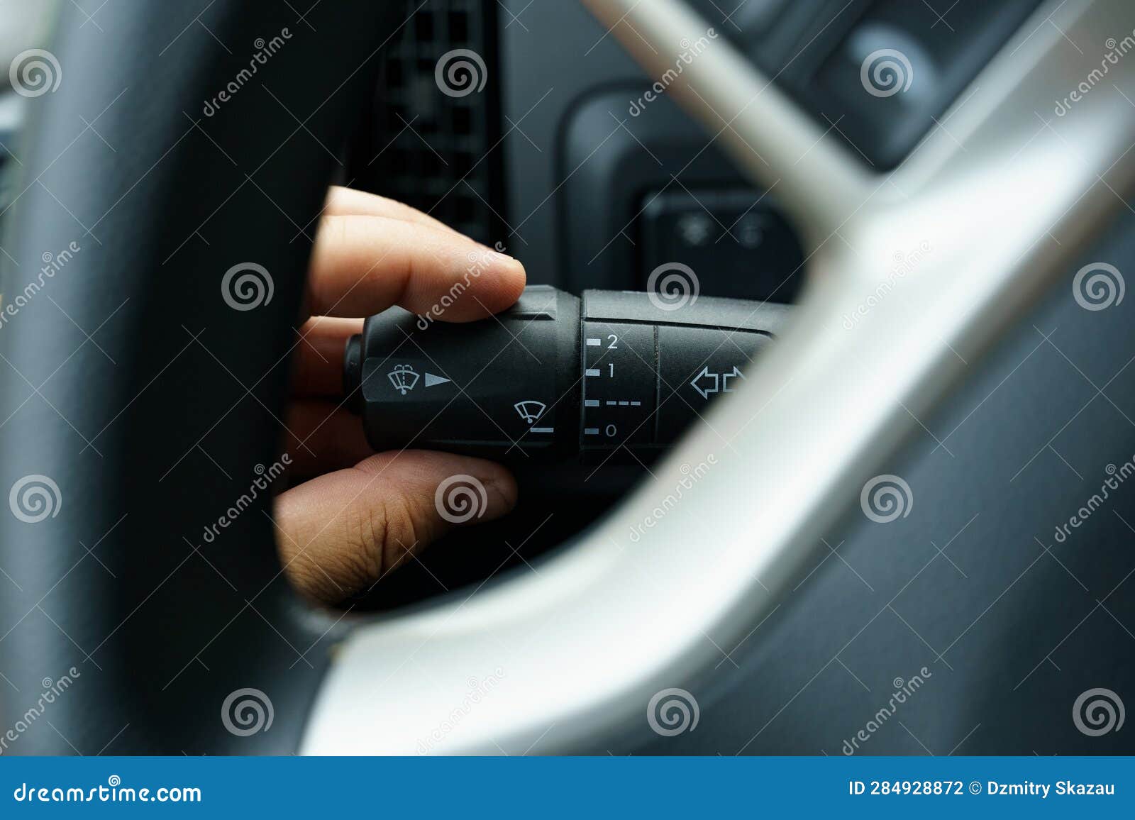 A Man S Hand Turns on the Windshield Wiper Switch Control Lever in a ...