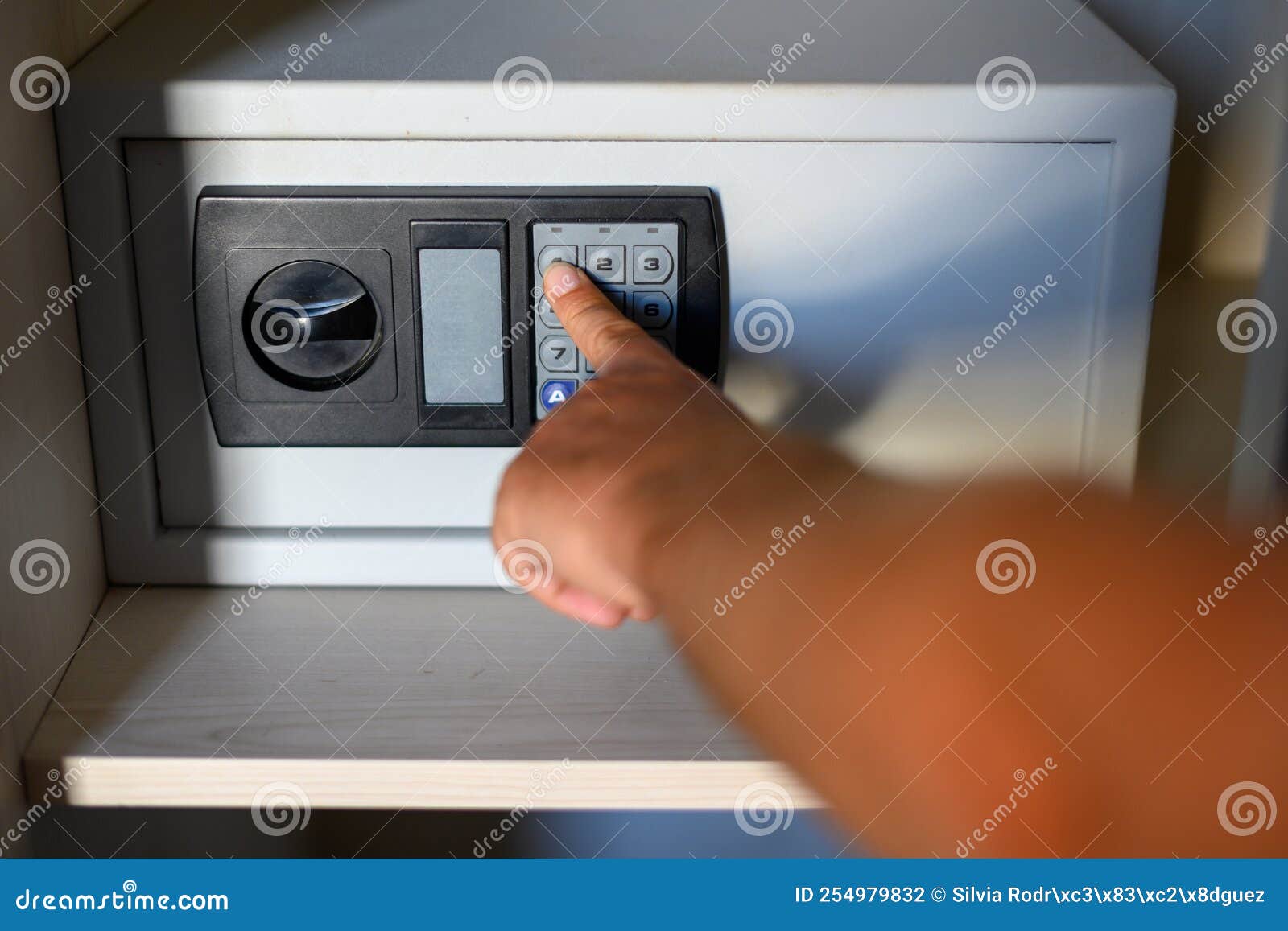 Man S Hand Types in the Combination of a Small Safe Stock Photo - Image ...