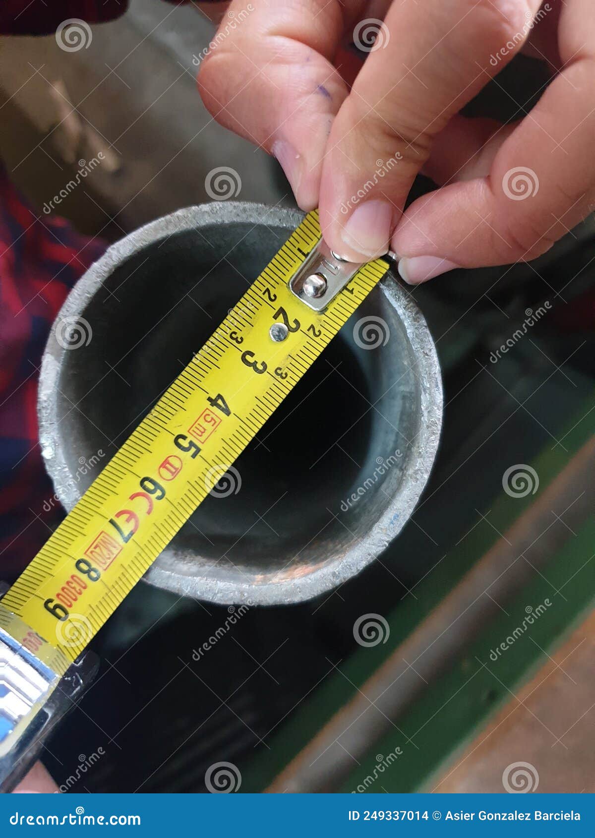 Man& X27;s Hand Using a Meter To Measure the Diameter Stock Photo ...