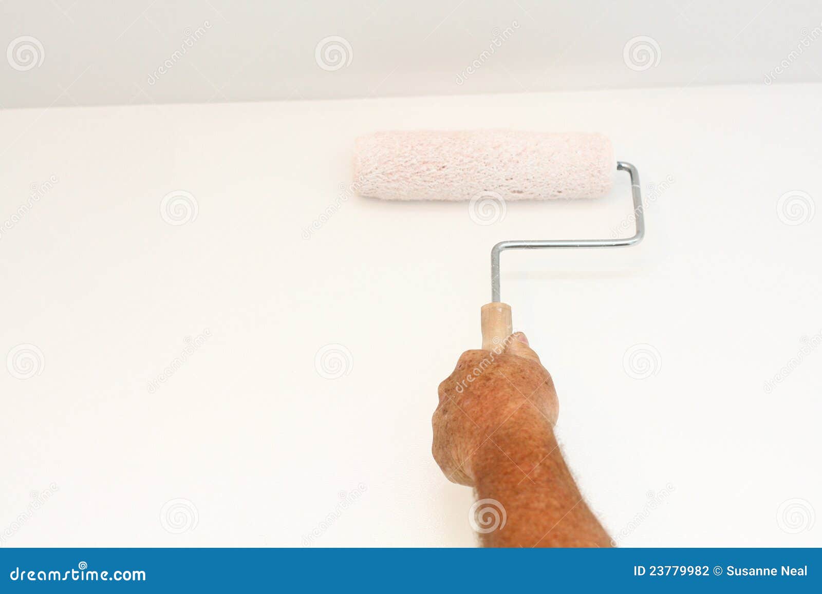 Man S Hand Using Paint Roller on White Wall Stock Photo - Image of ...