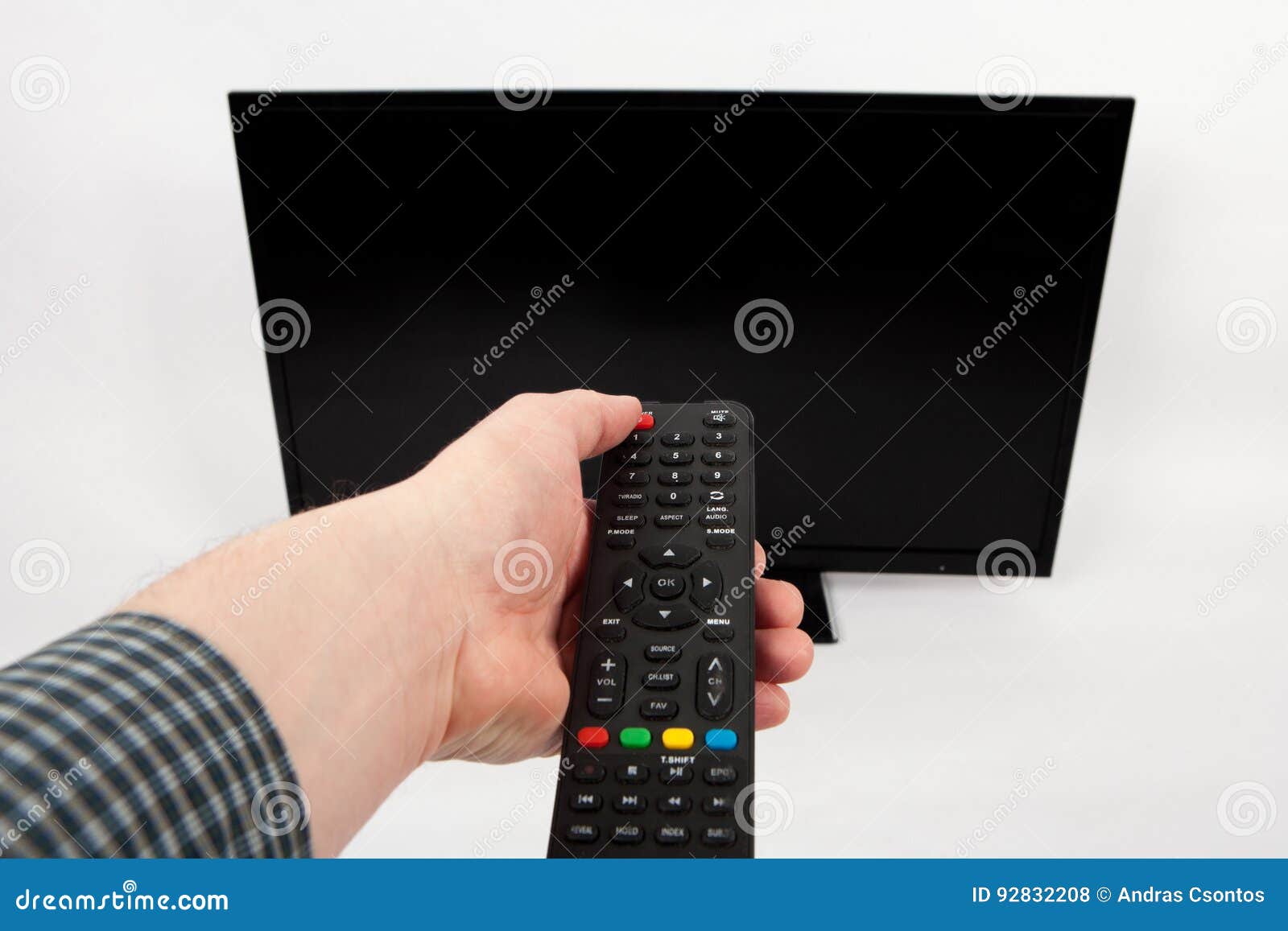 Man`s Hand Using Remote Control in Front of the TV. Stock Photo - Image ...