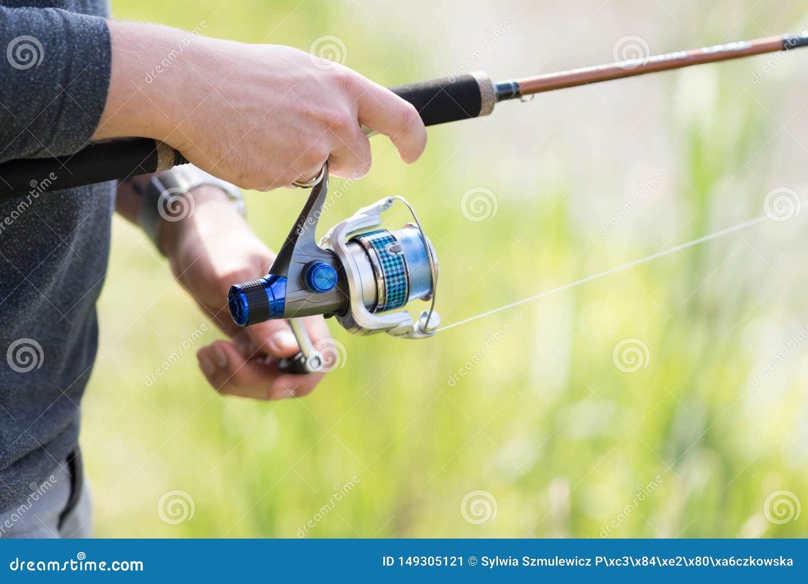 Man`s Hand Using Spinning Technique during Fishing Stock Image - Image ...