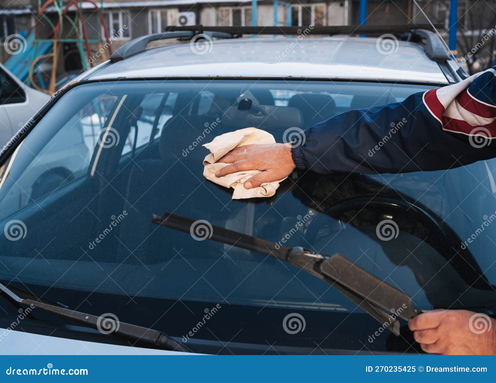 Man& X27;s Hand Wipes the Dusty Windshield of Car with a Napkin Stock ...