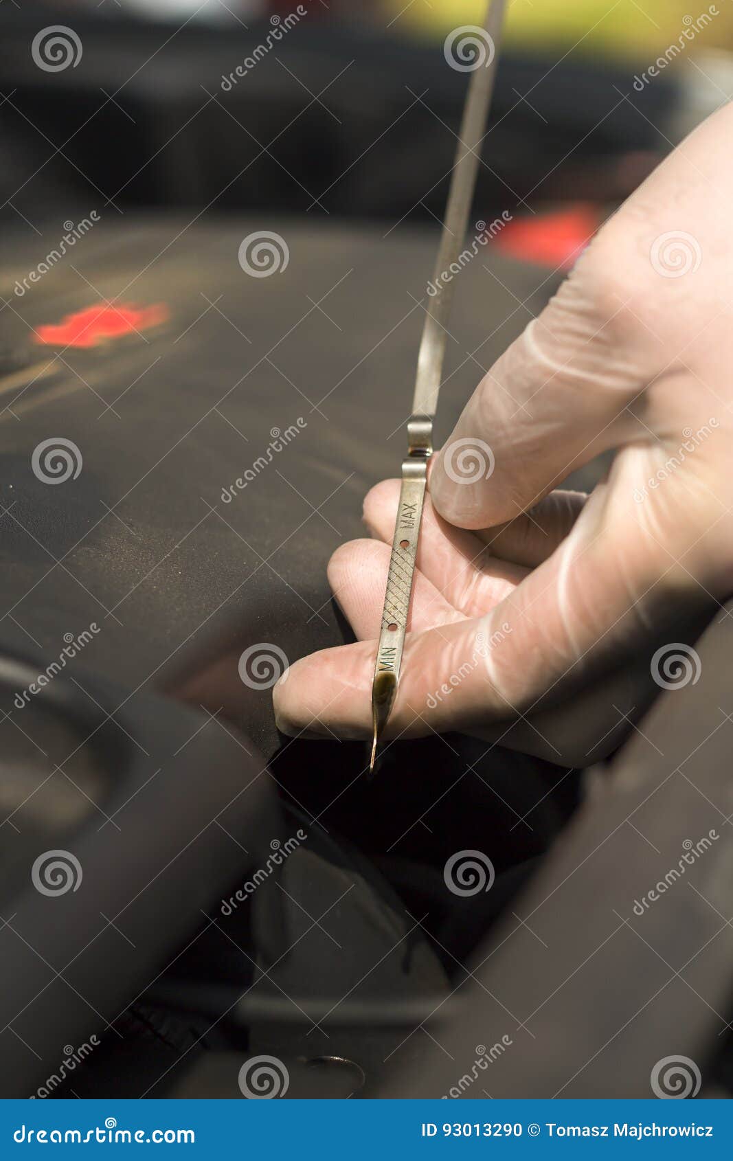 The Man`s Hands in Disposable Gloves Check the Oil Level in the Engine ...
