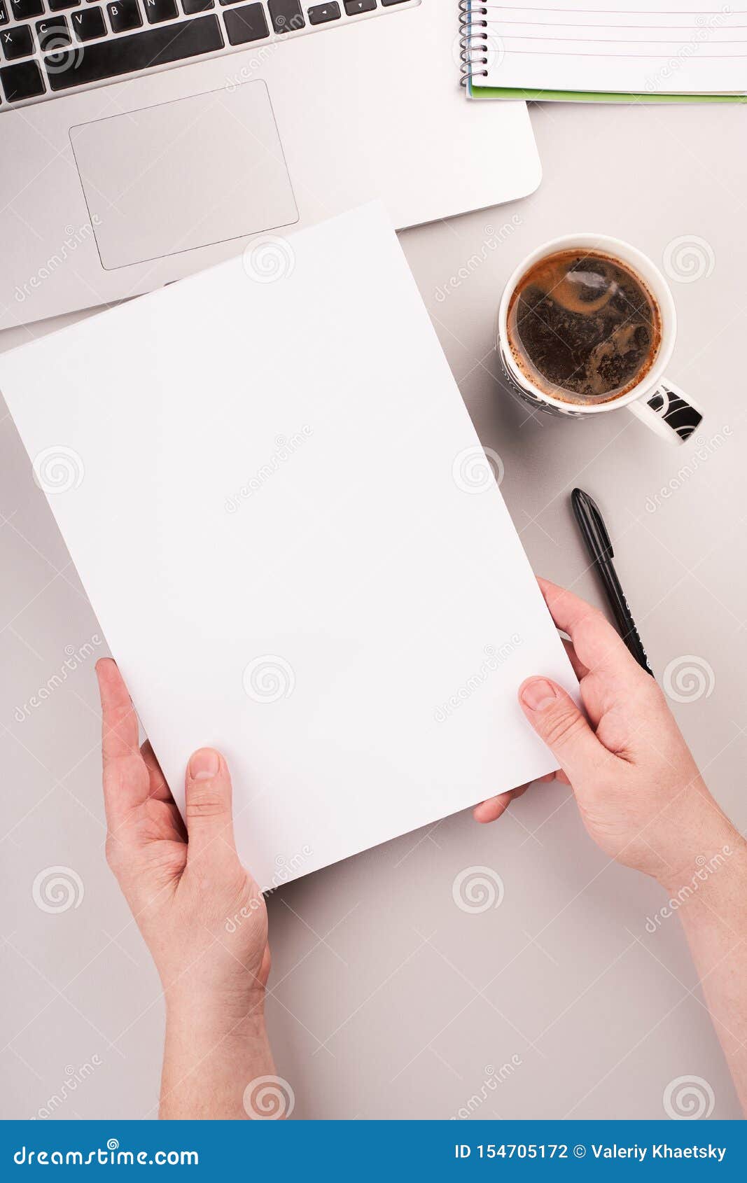 Man`s Hands Holding Blank Paper on the Working Desk with Computer and ...