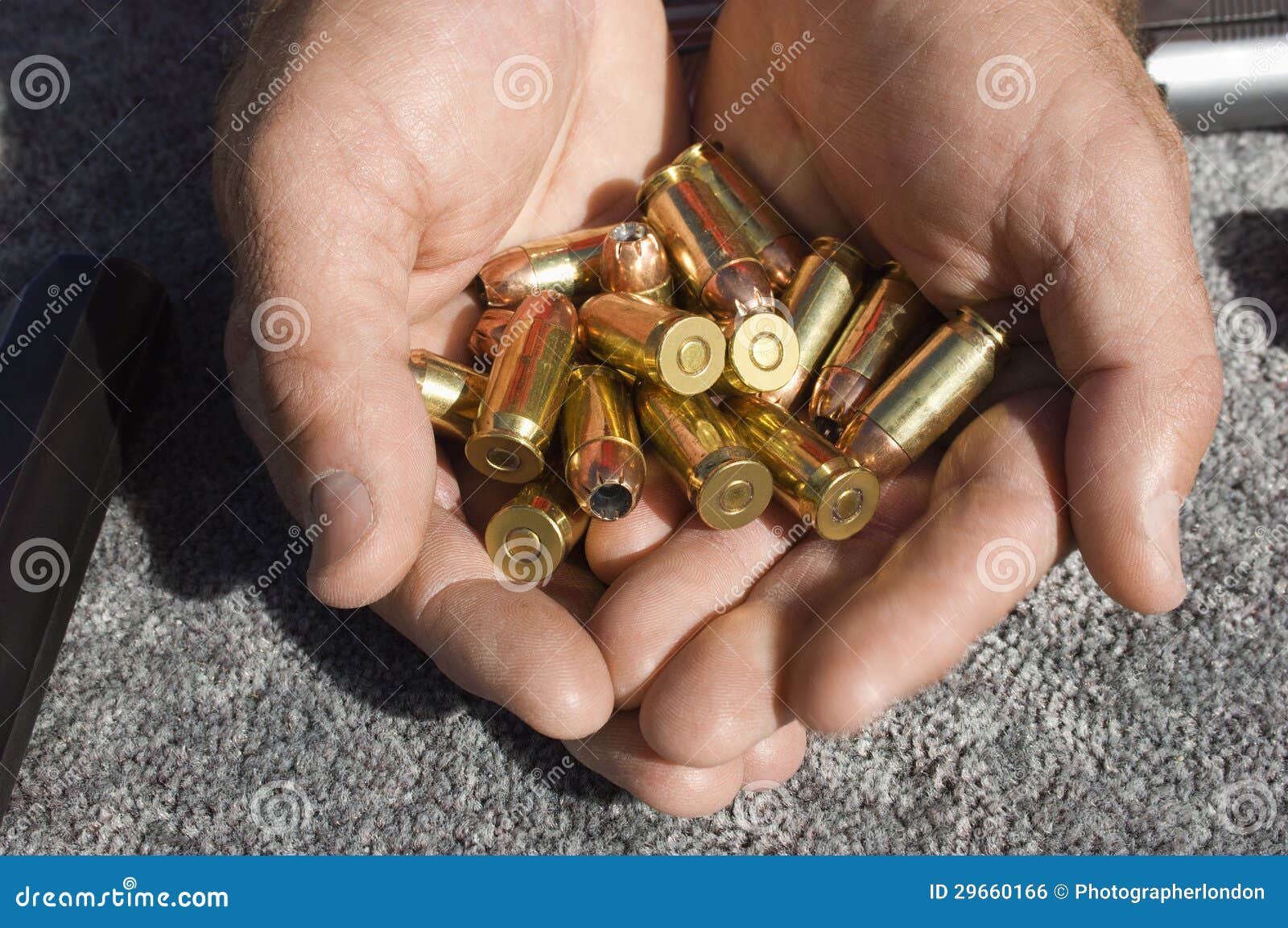 Man S Hands Holding Bullets Stock Photo - Image of metal, armament ...