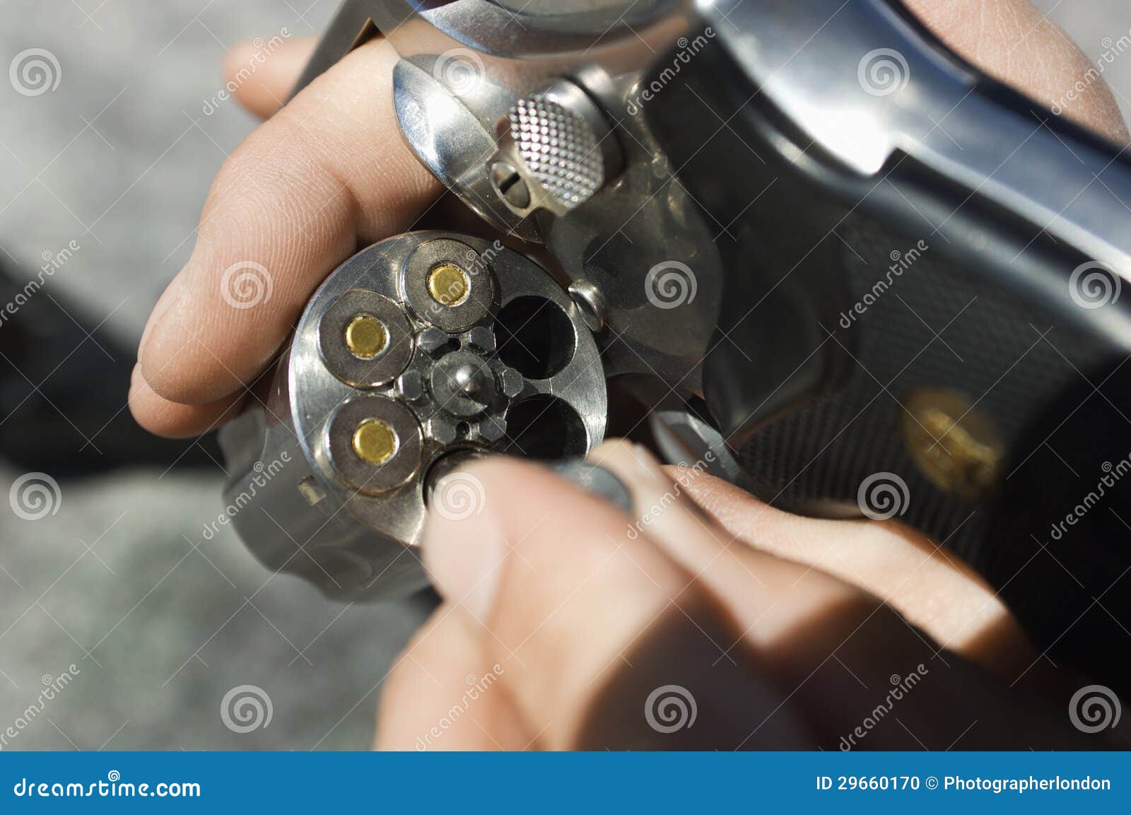 Man S Hands Loading Bullets into Gun Stock Photo - Image of metal ...