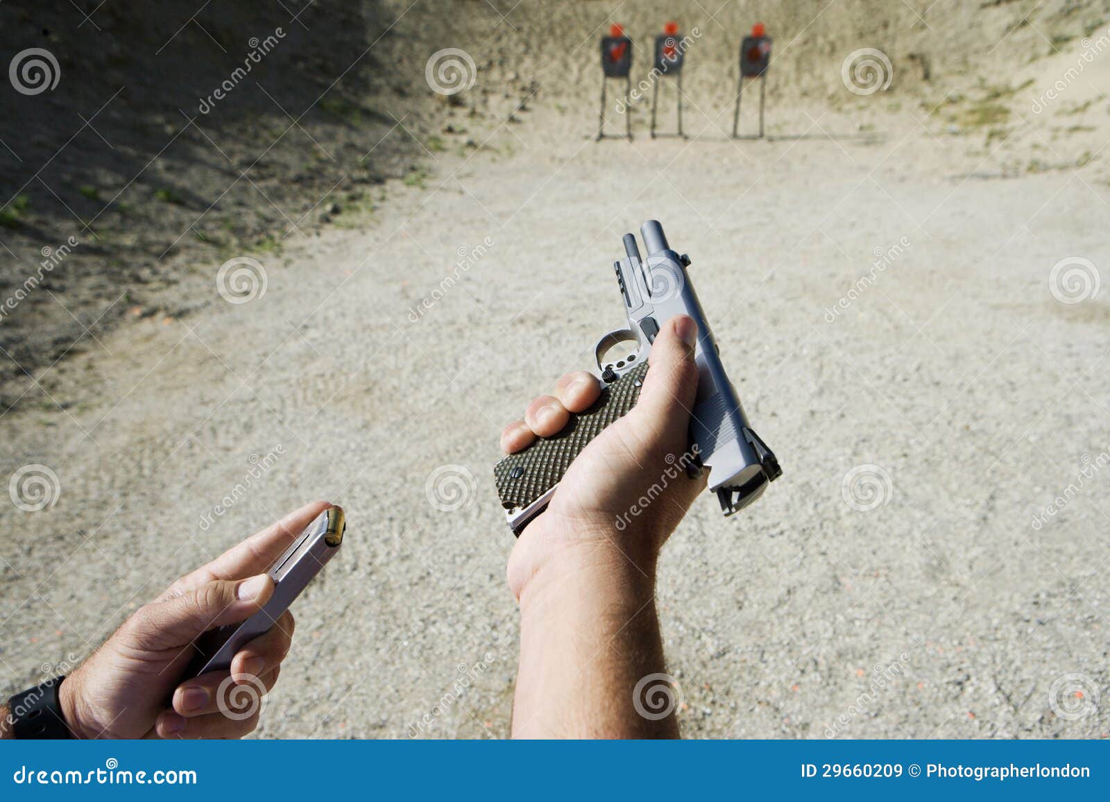 Man S Hands Loading Gun at Firing Range Stock Image - Image of outdoors ...
