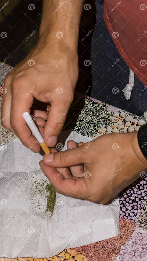 Man`s Hands Making a Marijuana Joint of Cigarette Stock Image - Image ...