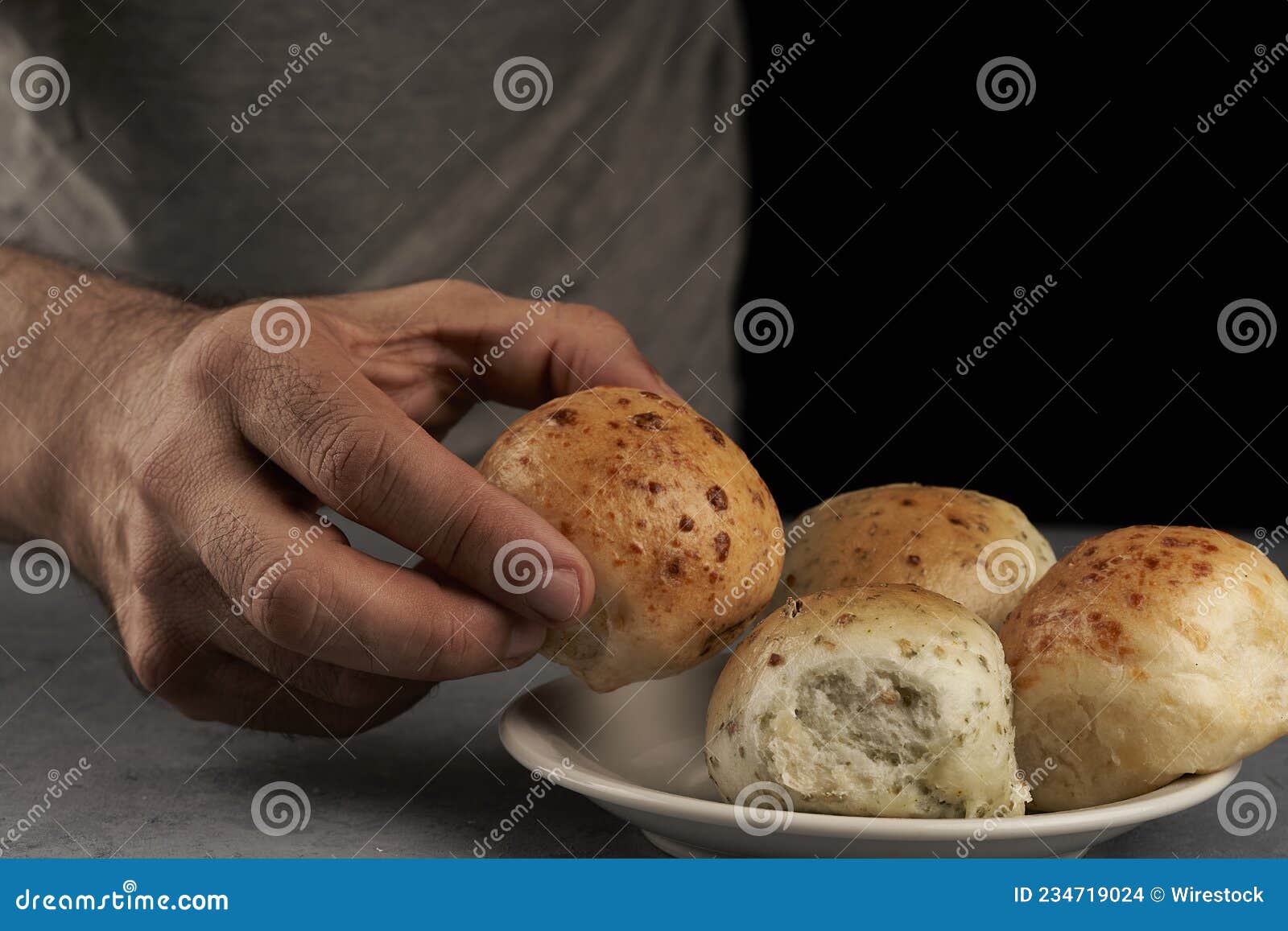 Man& X27;s Hands Placing Flavored Breads on a Plate Stock Photo - Image ...