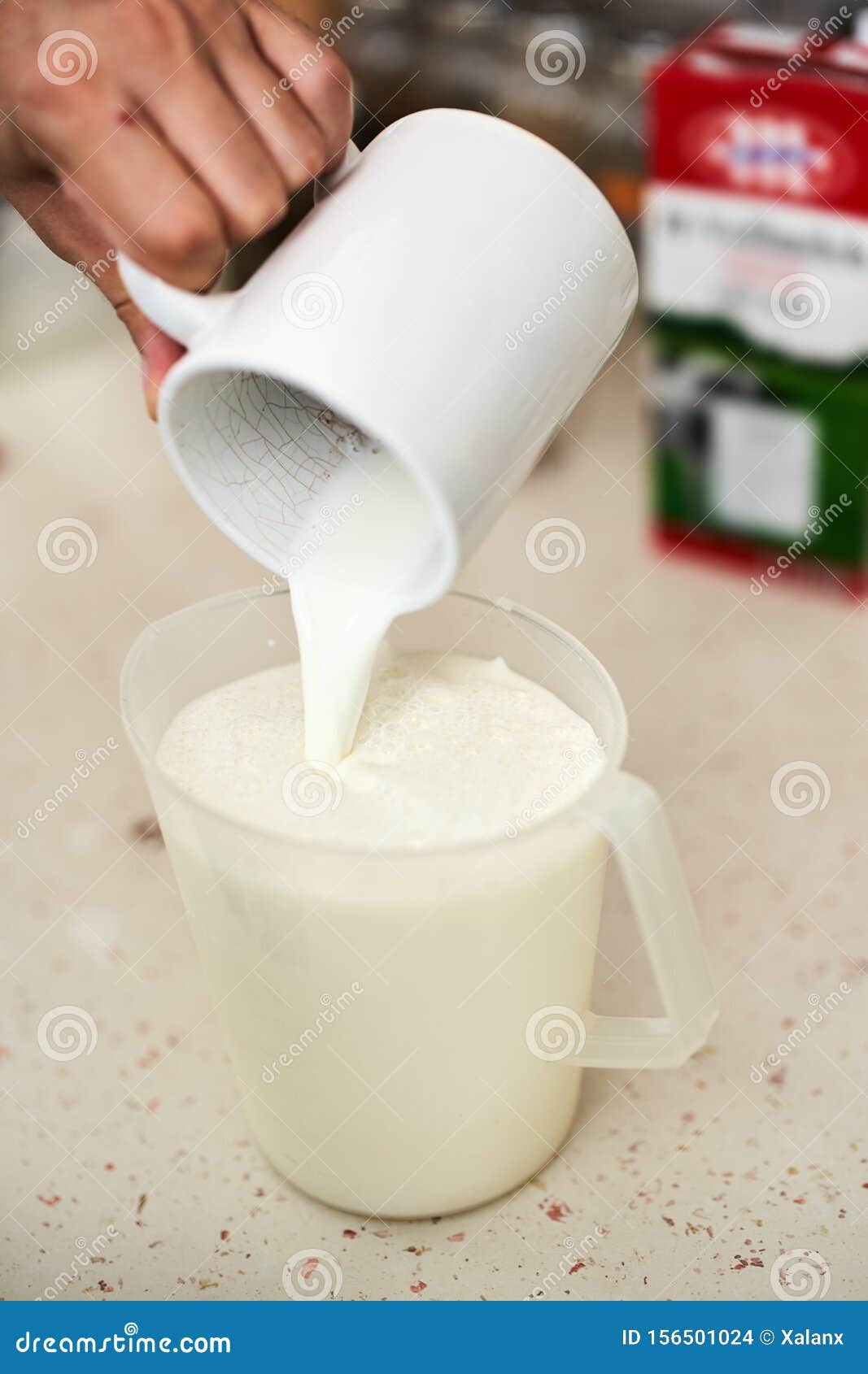 Man`s hands pouring milk stock photo. Image of preparing - 156501024