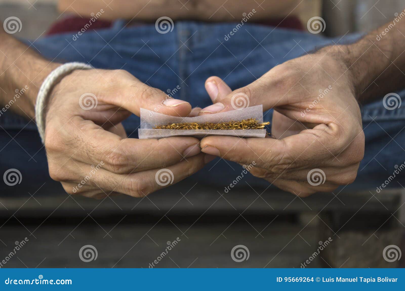 Man`s Hands Rolling a Joint Stock Photo - Image of cannabis, drug: 95669264