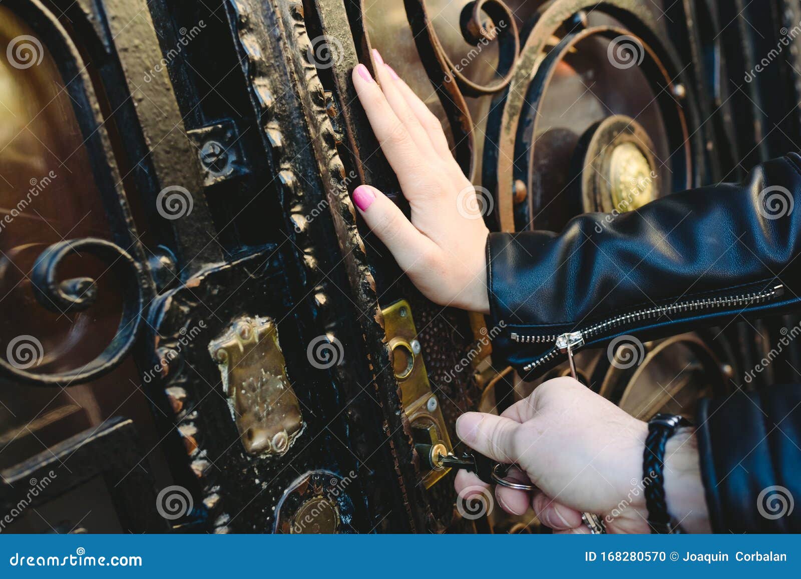 Man`s Hands Trying To Open a Door by Inserting the Key into the Lock ...