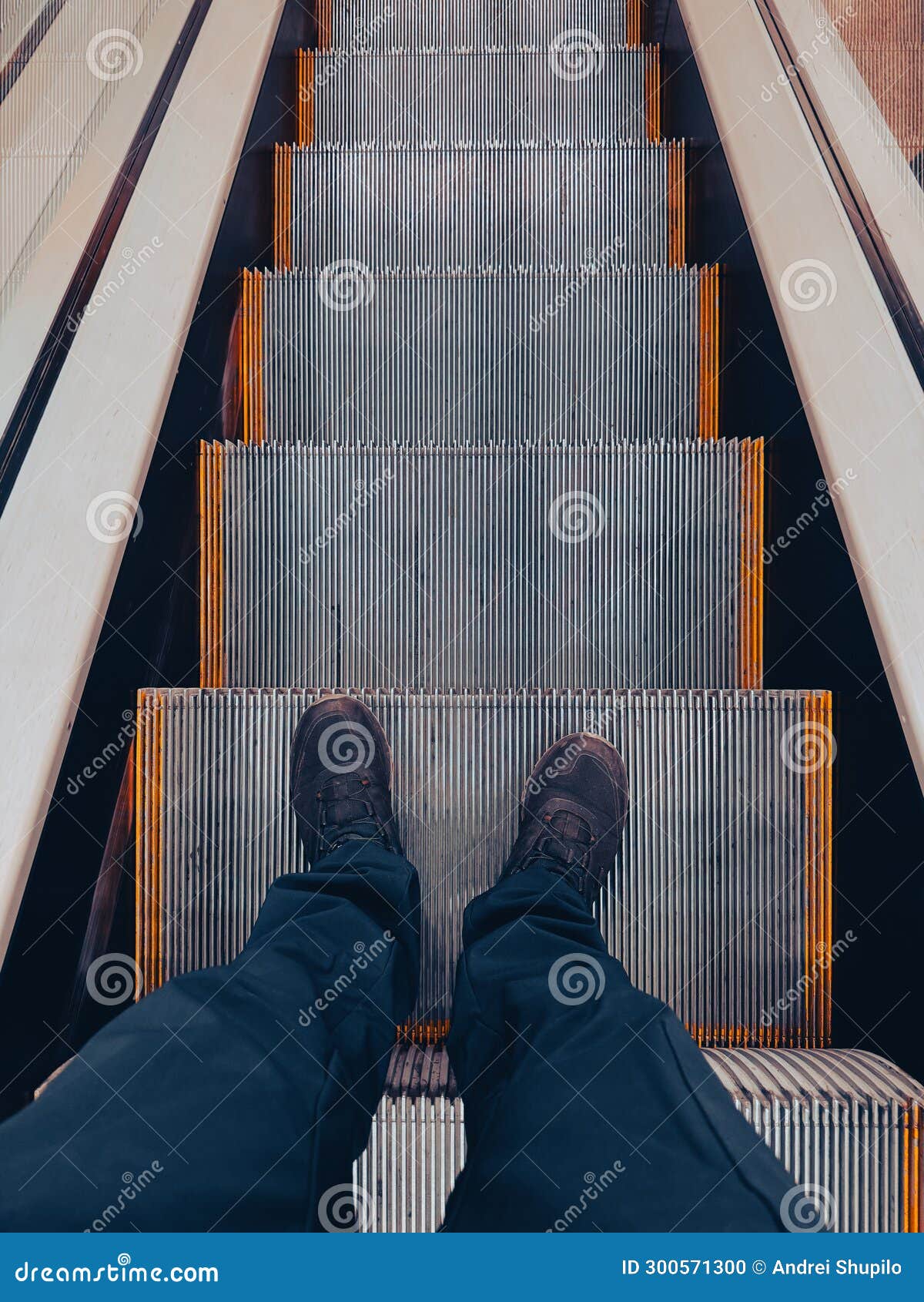 A Man& X27;s Legs on the Steps of an Escalator Stock Photo - Image of ...