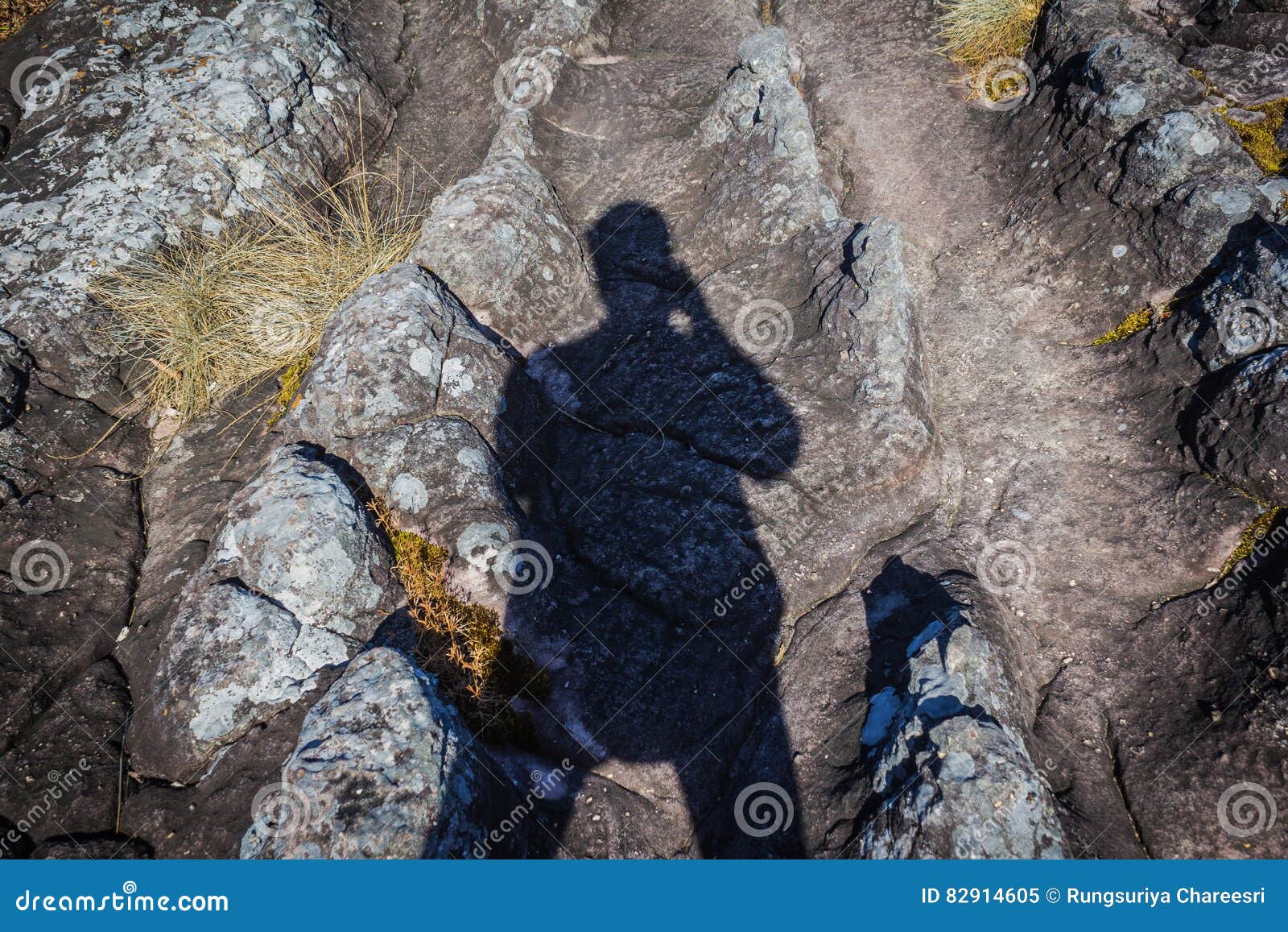 Man`s Shadow on the Rock and Stone Yard. Stock Image - Image of long ...
