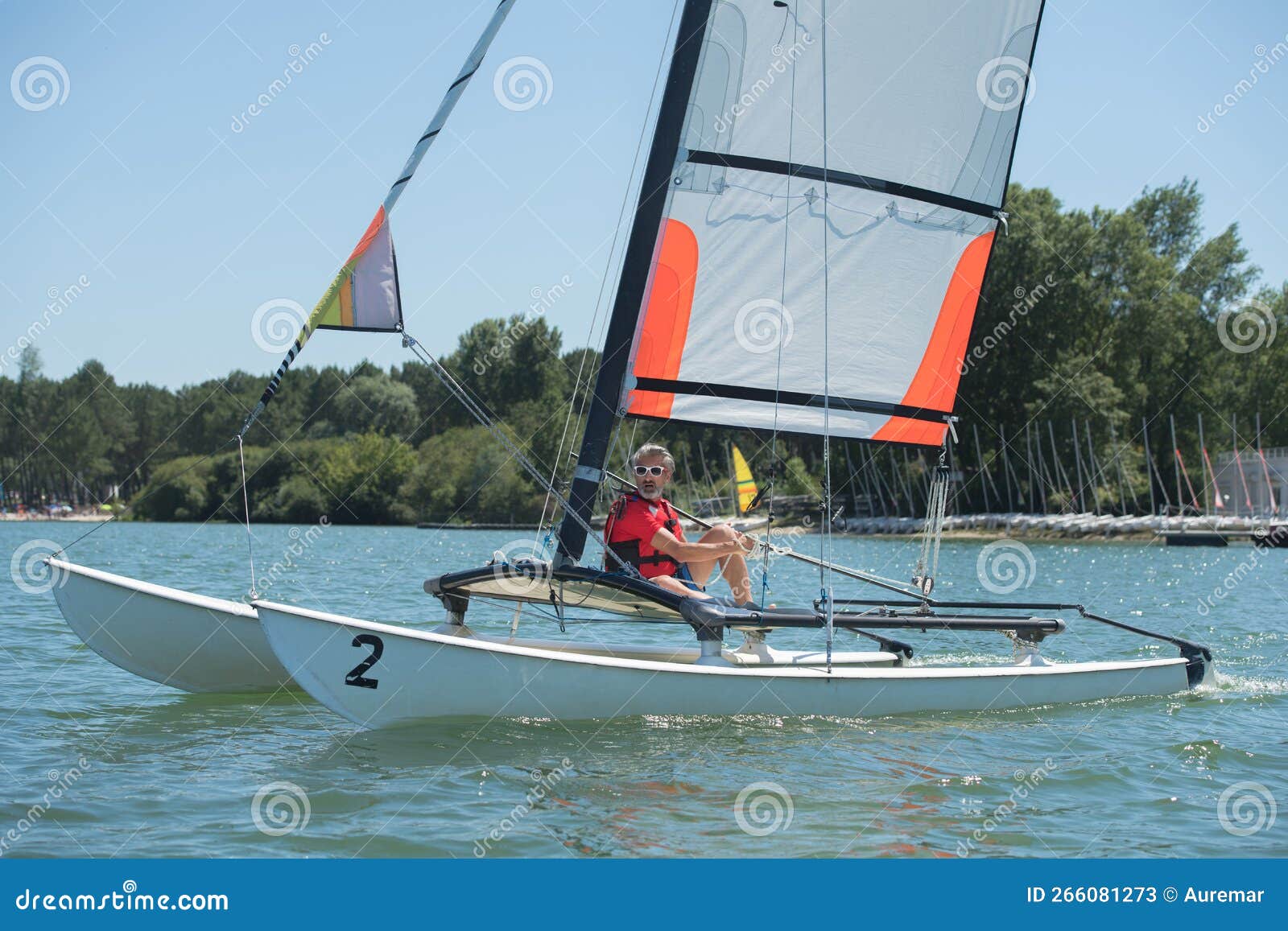 Man on sail boat stock image. Image of hobby, yachting - 266081273