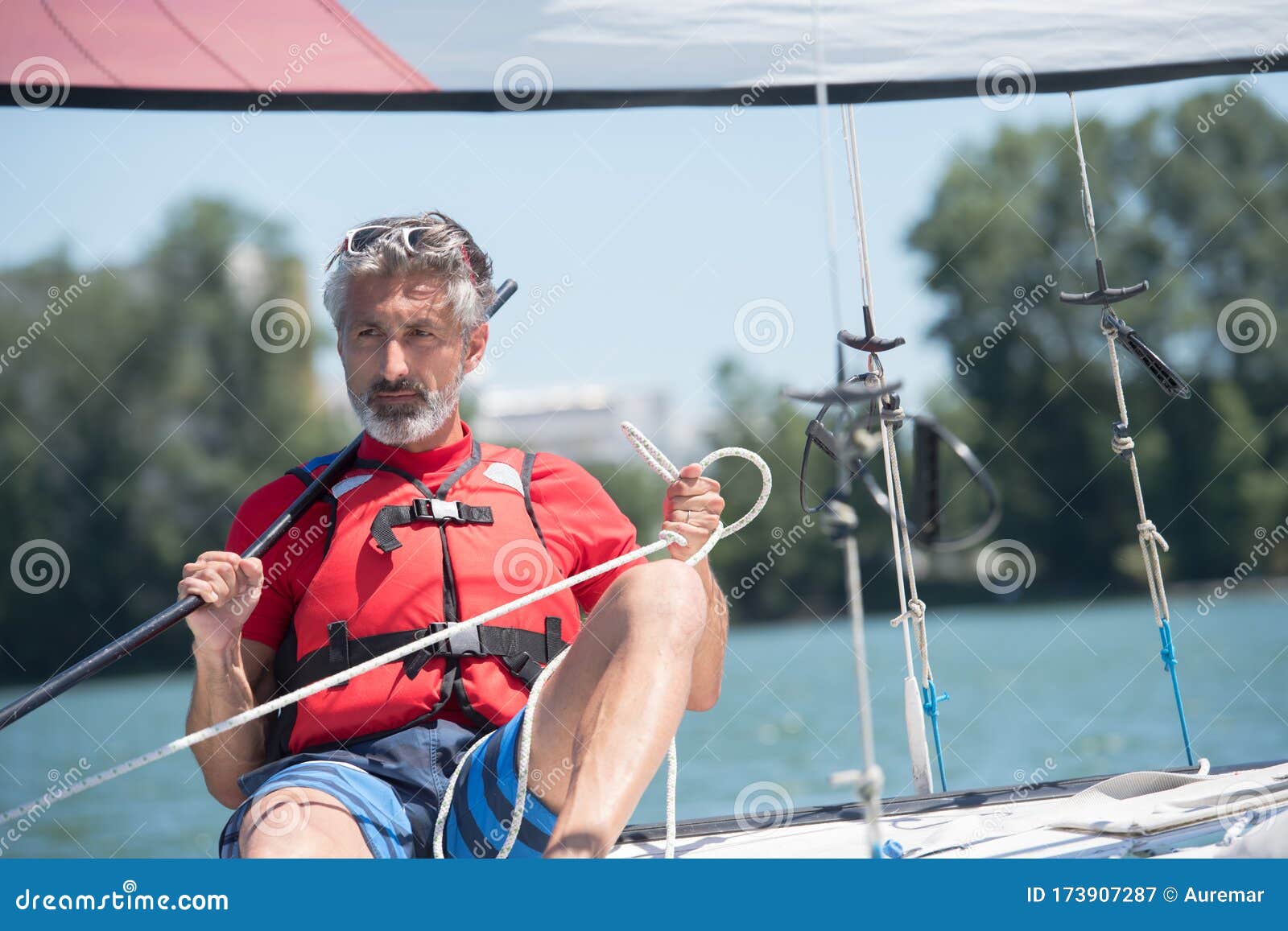 Man on Sailboat Navigating Sails Stock Image - Image of speed, teamwork ... Man on Sailboat Navigating Sails Stock Image - Image of speed, teamwork ...