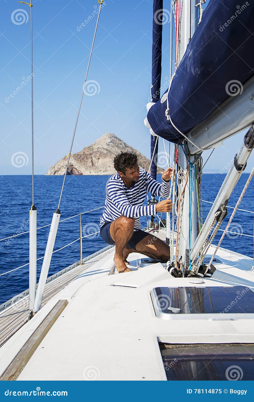 Man on sailboat stock image. Image of sailor, sunny, nautical - 78114875