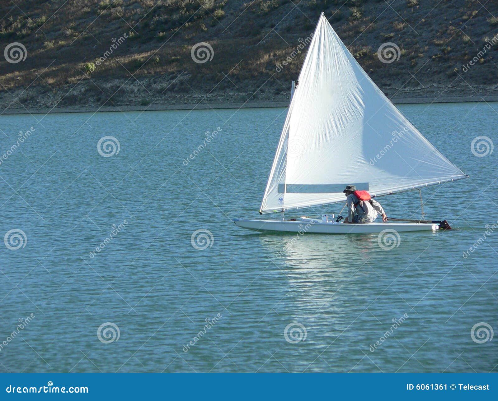 Man Sailing a Dinghy stock image. Image of watersport - 6061361