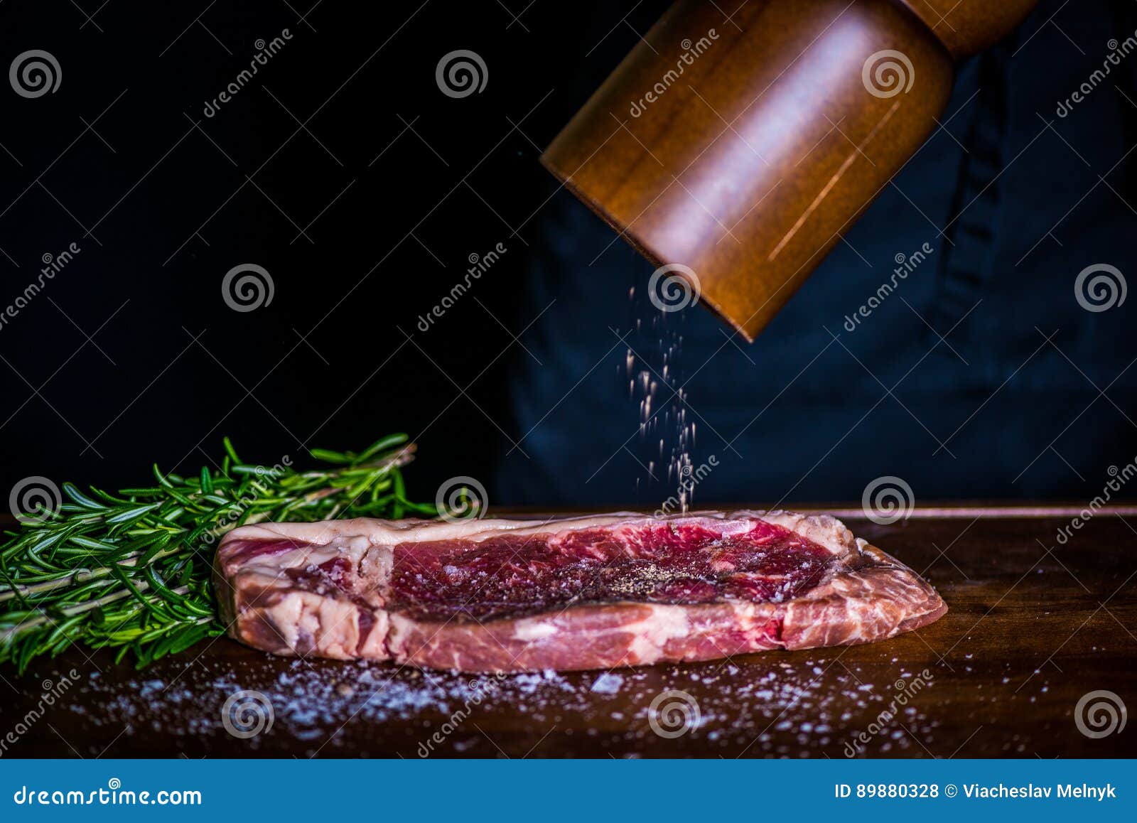 Man is salting meat steak stock photo. Image of shaker - 89880328