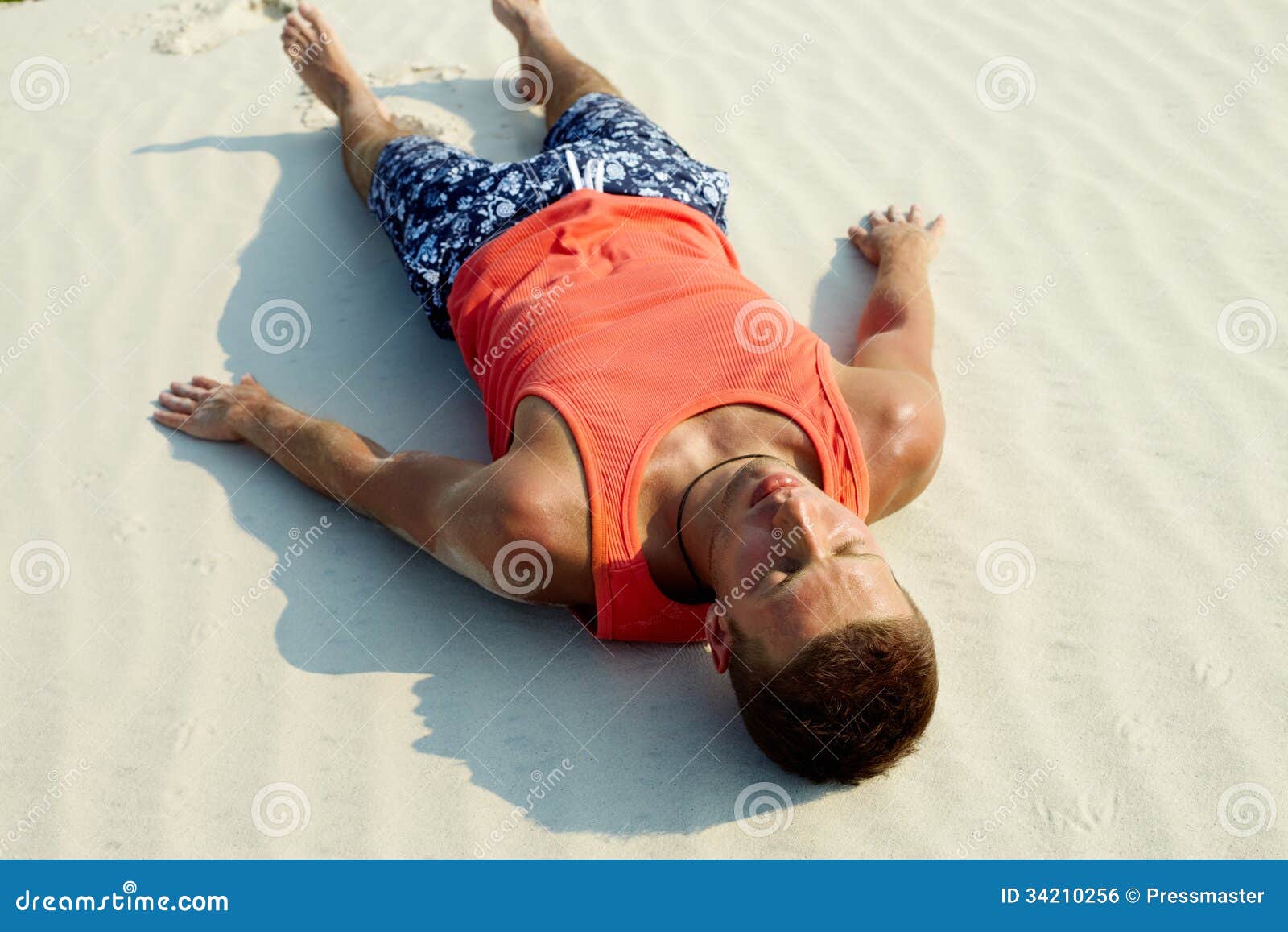 Man on sand stock photo. Image of handsome, relaxing - 34210256