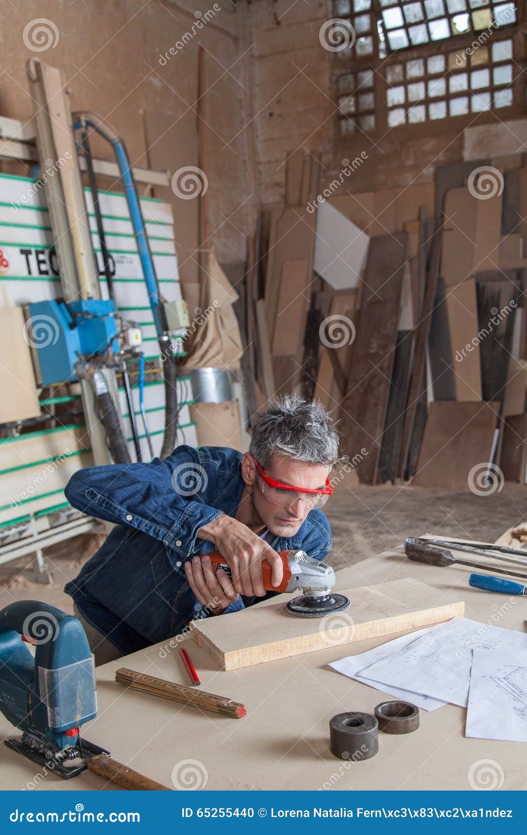 Man with a sander stock photo. Image of carpentry, sander - 65255440