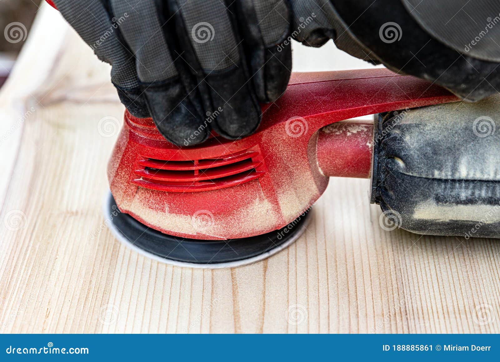 Man is Sanding with an Disk Type Sander or Orbital Sander a Wooden ...