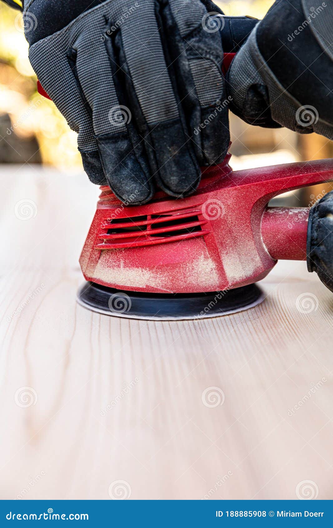 Man is Sanding with an Disk Type Sander or Orbital Sander a Wooden ...