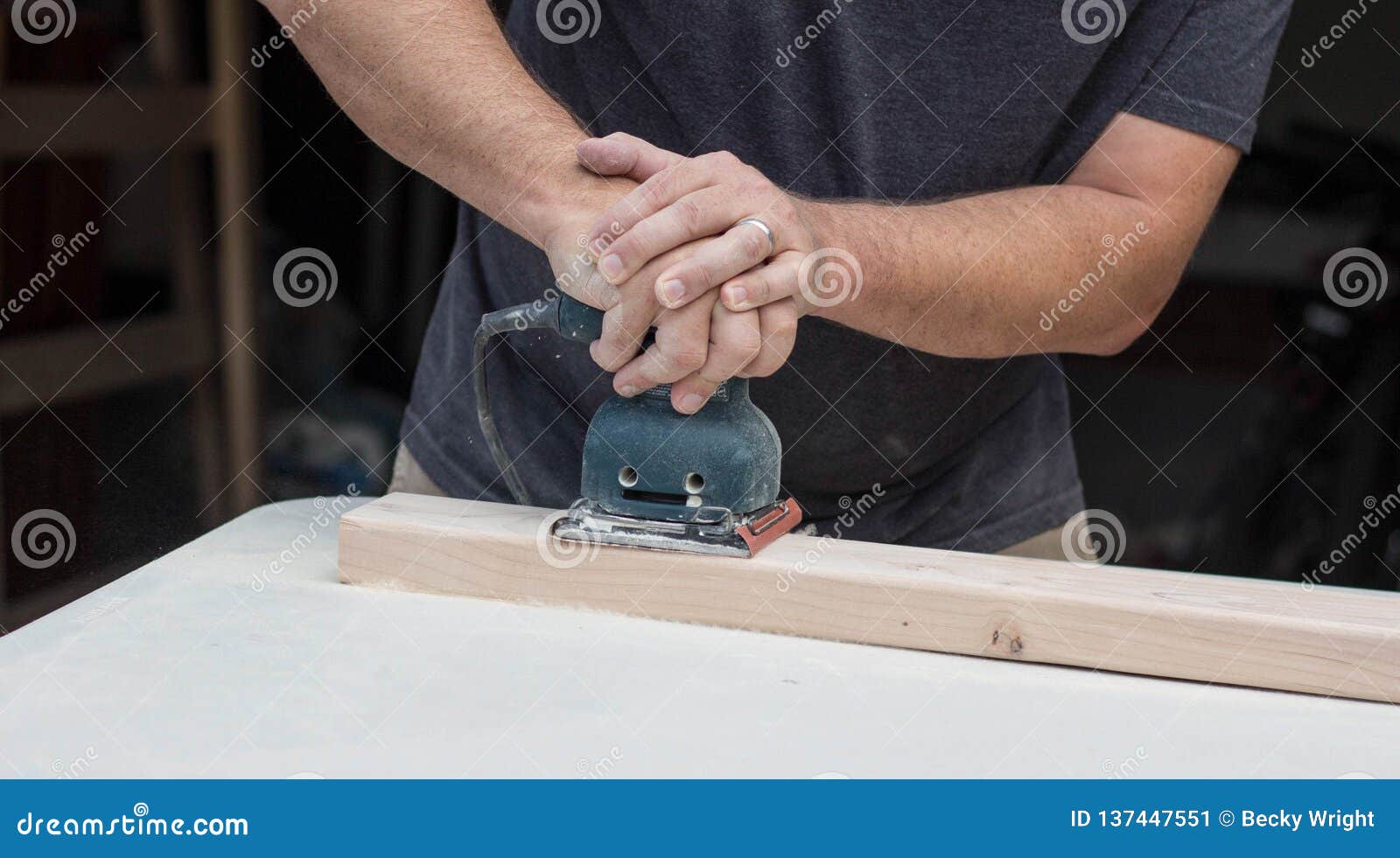 Man Sanding a DIY Project stock image. Image of building - 137447551