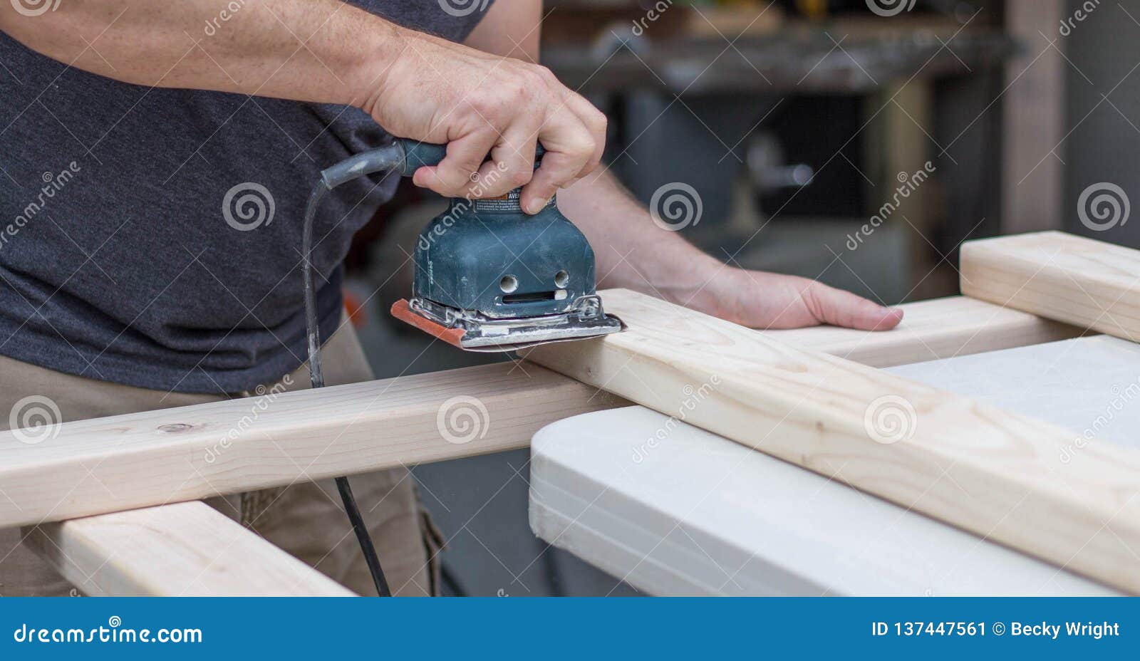 Man Sanding a DIY Project stock image. Image of home - 137447561