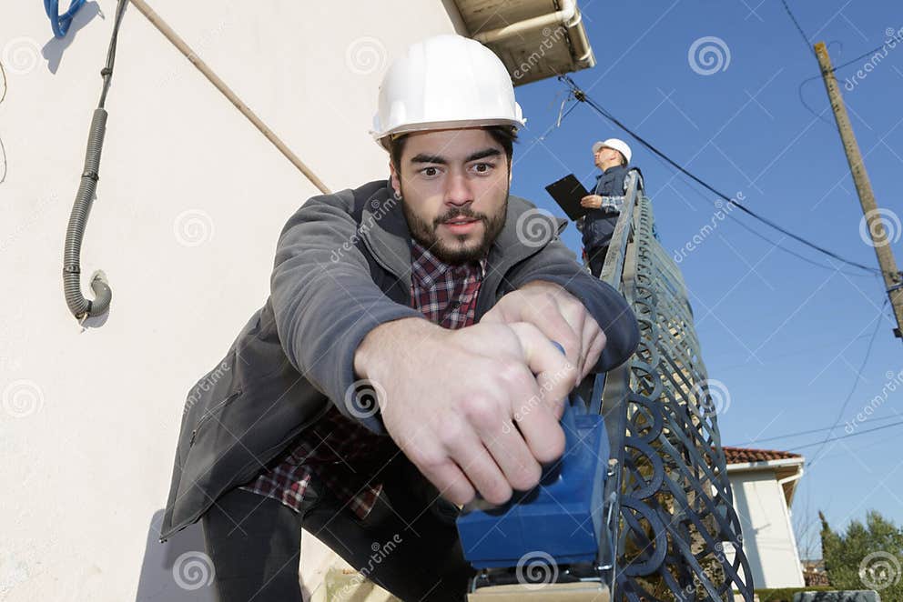 Man Sanding Exterior Hand Rail Stock Photo - Image of exterior, railing ...