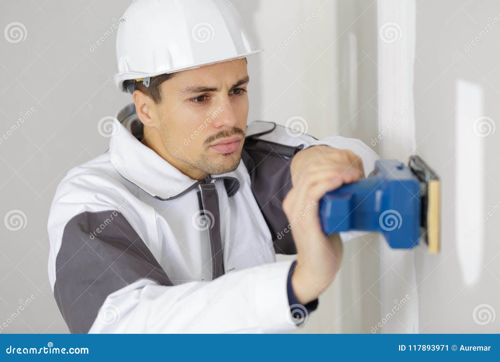 Man with Sanding Machine in Clothing Construction Stock Image - Image ...