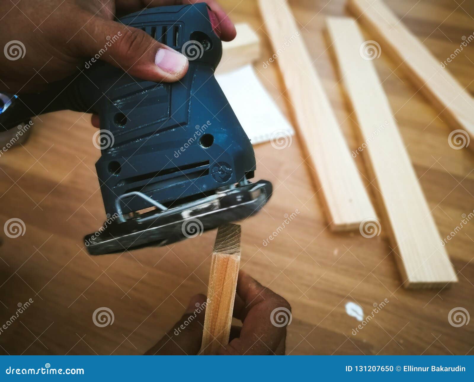 Man Sanding Wood with Square Sander in a Workshop. Stock Photo - Image ...