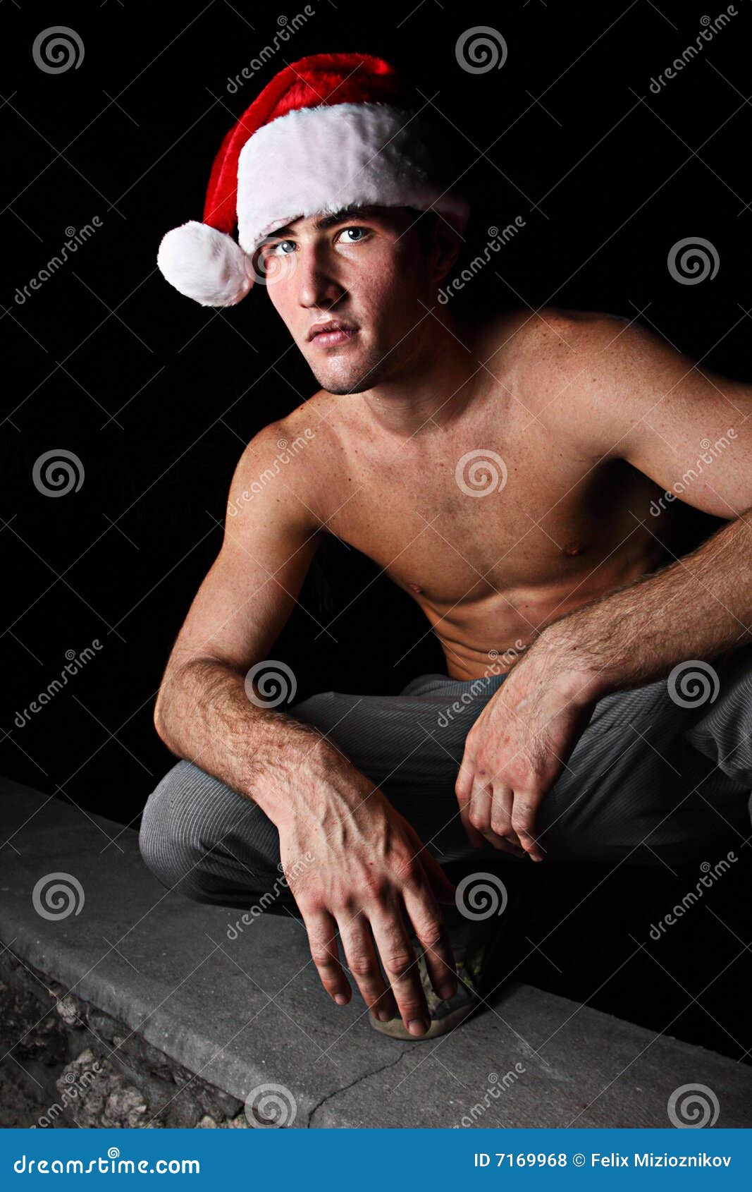 Man in a Santa hat stock photo. Image of wearing, shirtless - 7169968