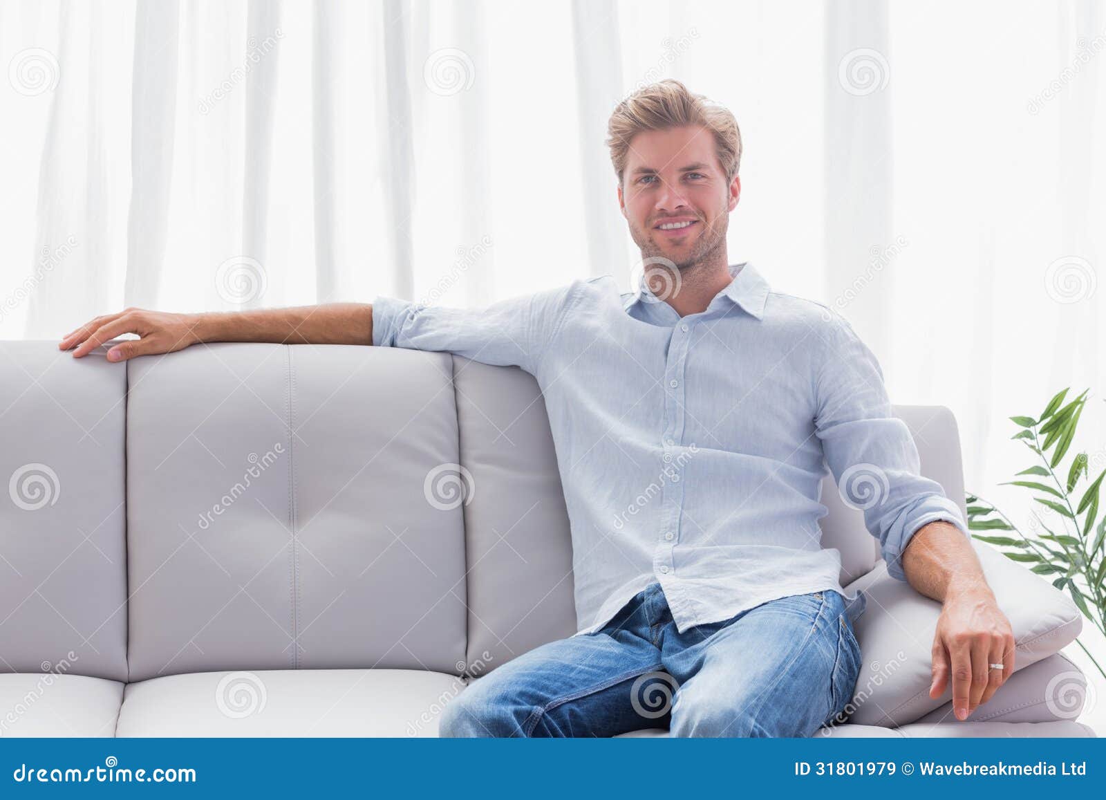 Man Sat on a Couch in the Living Room Stock Image - Image of abode ...