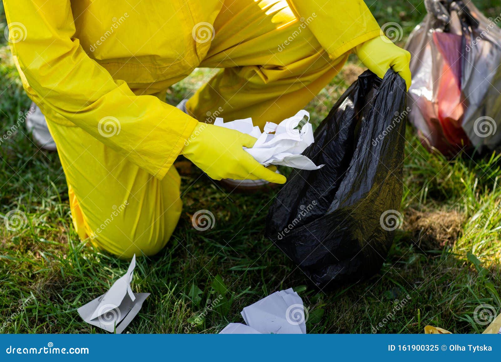 The Man Sat Down and Collected the Garbage in a Trash Bag. a Man in a ...