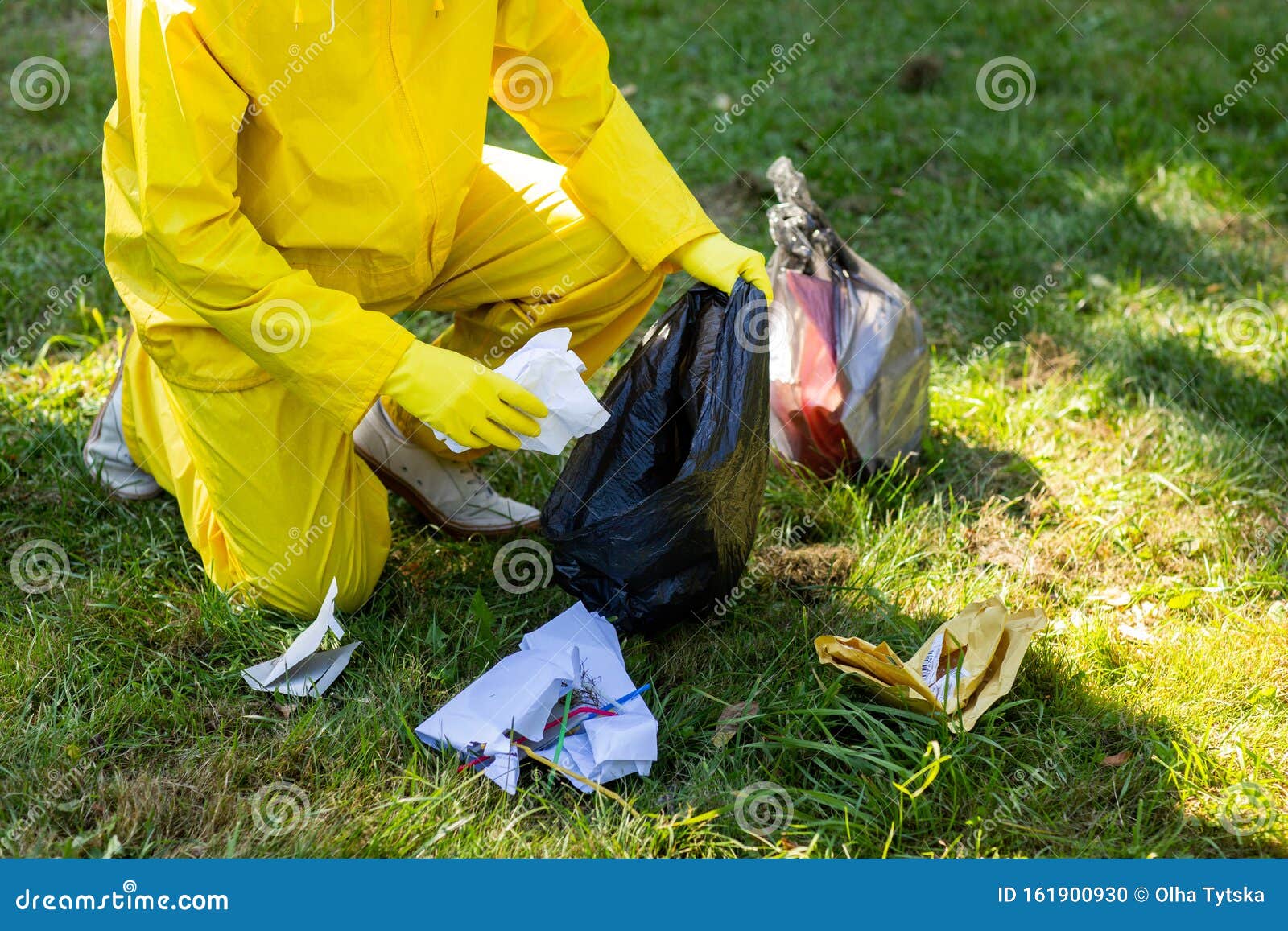 The Man Sat Down and Collected the Garbage in a Trash Bag. a Man in a ...