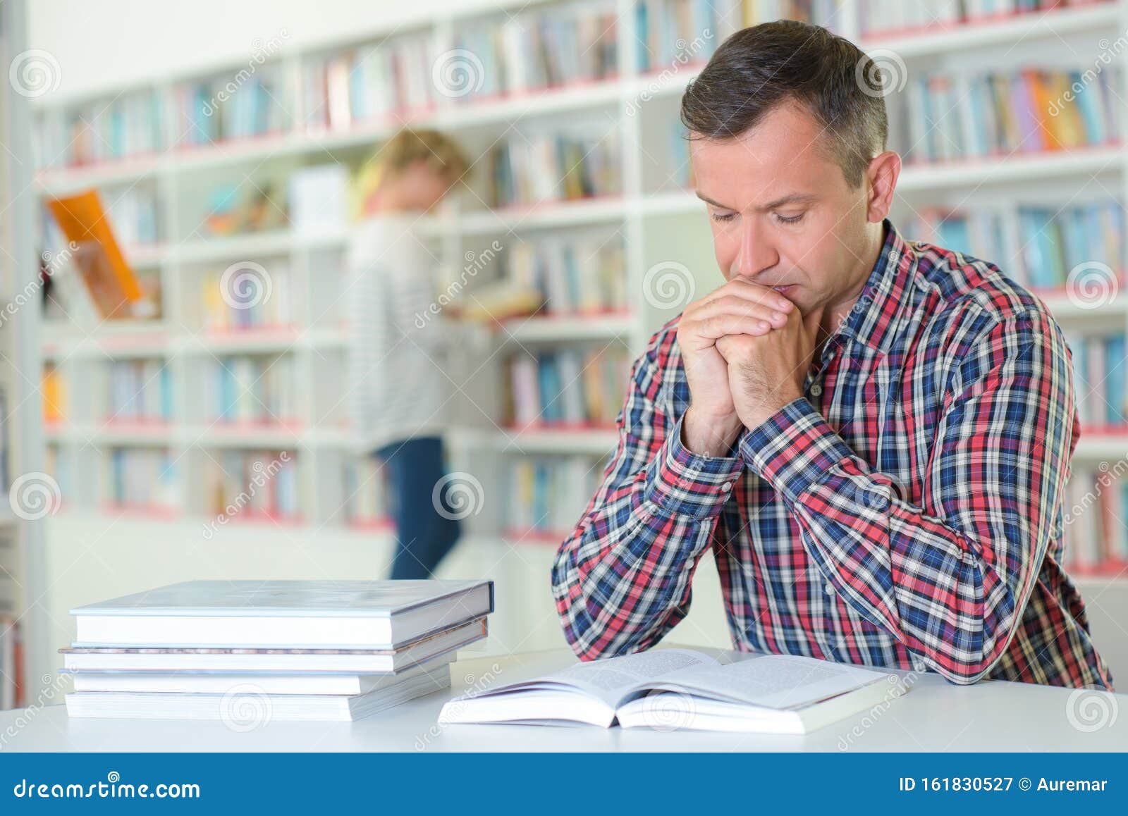 Man Sat Reading at Table in Library Stock Image - Image of table ...