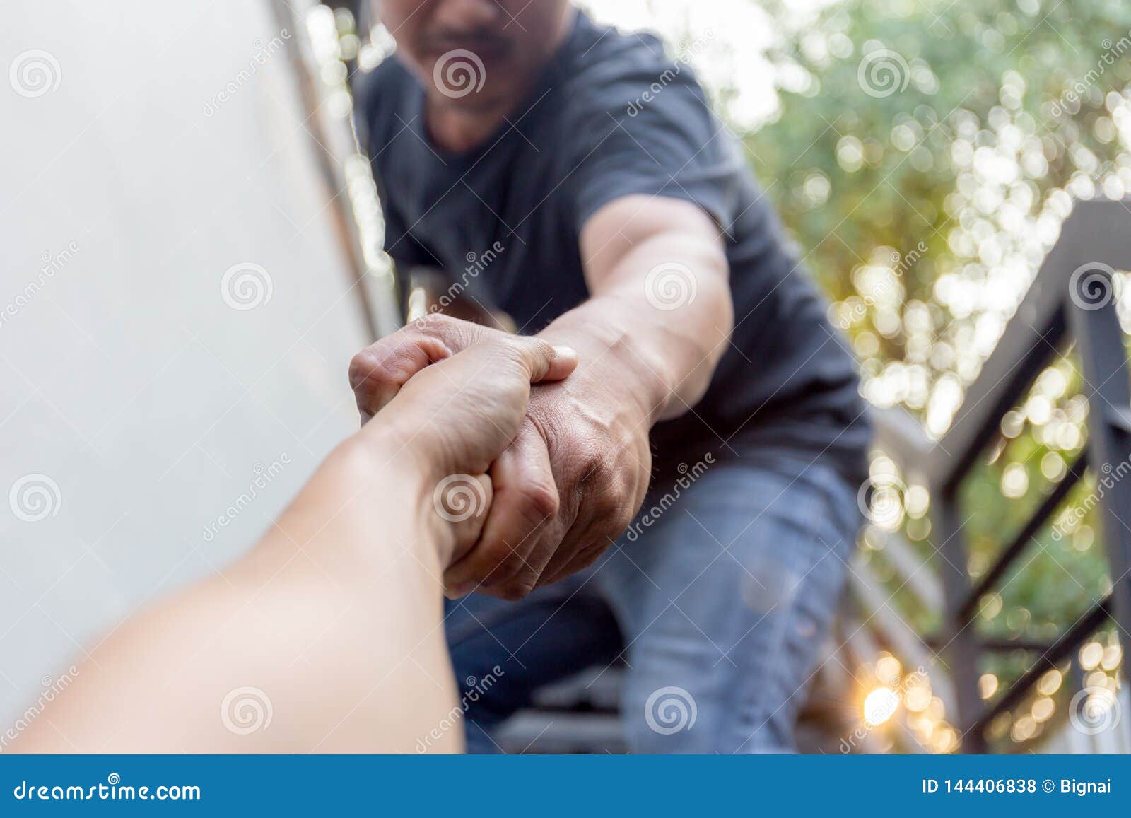 Man Saving Other By Griping The Forearm Rescuing And Helping Concept ...
