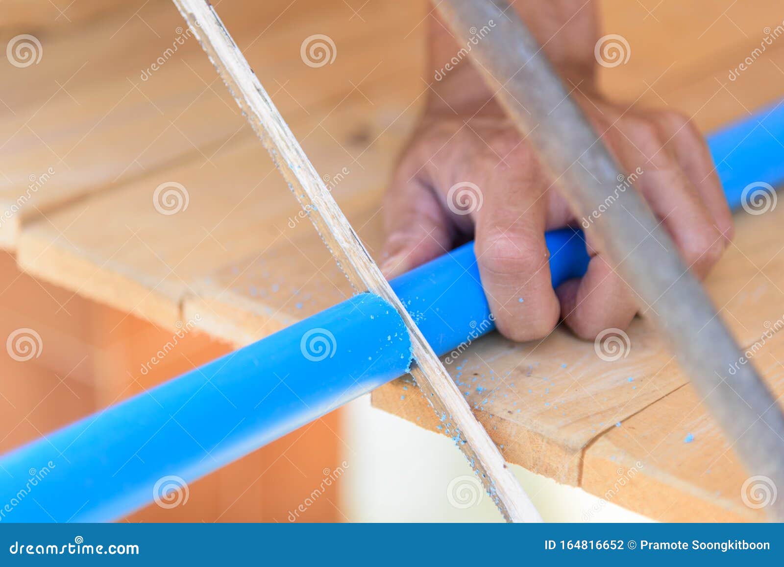 Saw the PVC tube pipe stock photo. Image of improvement - 164816652
