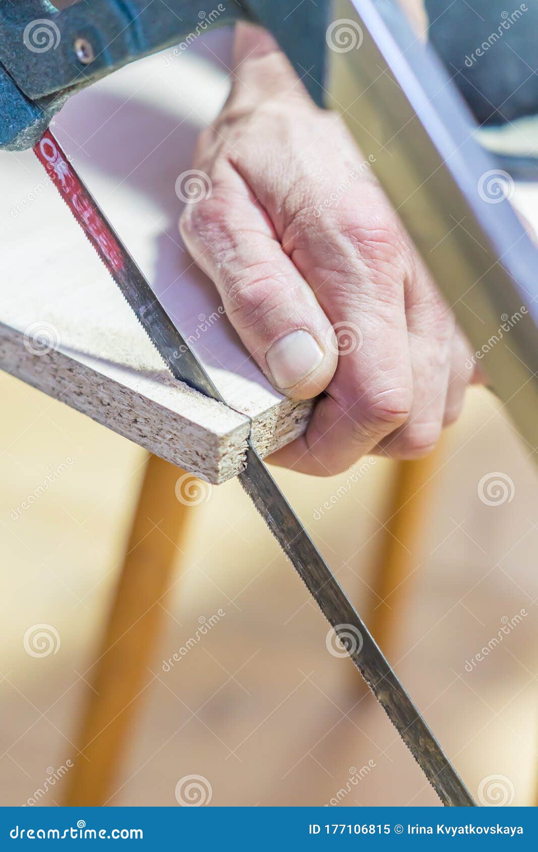 Man Sawing a Board with a Hacksaw Stock Image - Image of equipment ...