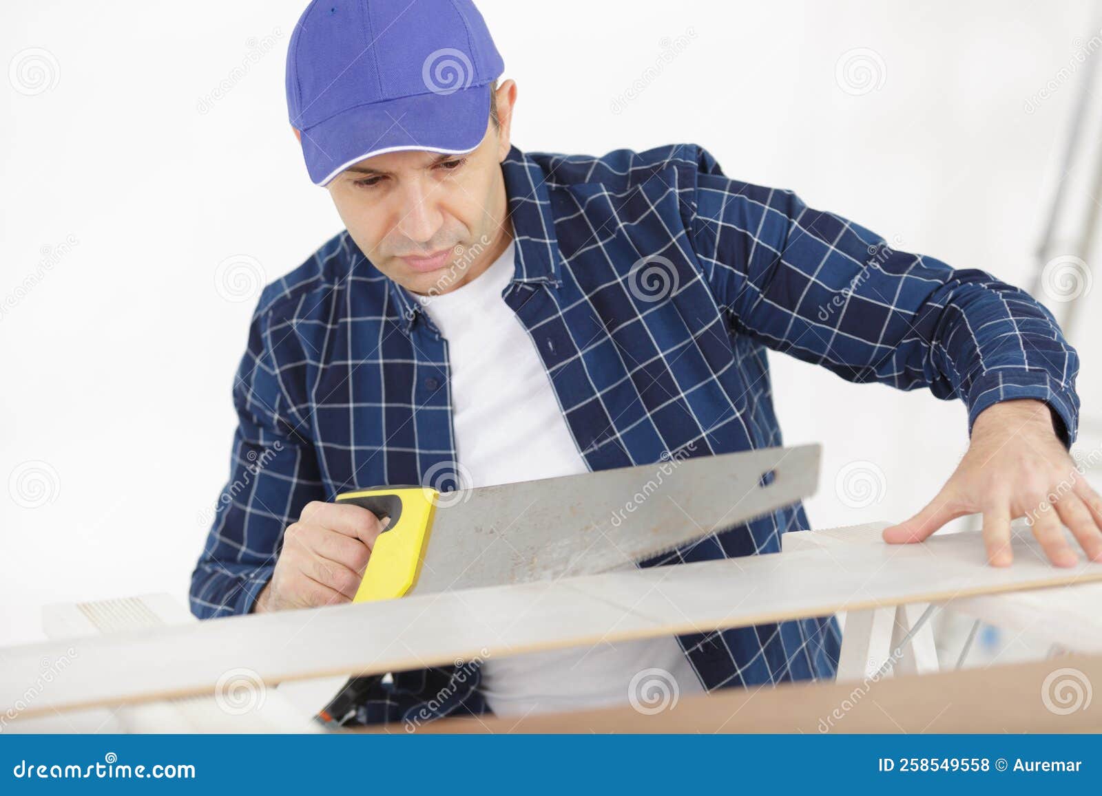 Man Sawing Plank in Workshop Stock Photo - Image of plank, metal: 258549558