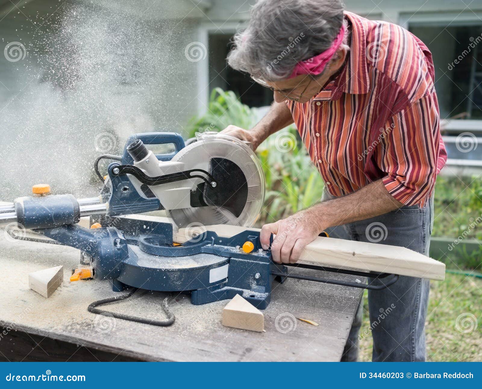 Man Sawing Wood with Sliding Compound Miter Saw Stock Image - Image of ... Man Sawing Wood with Sliding Compound Miter Saw Stock Image - Image of ...