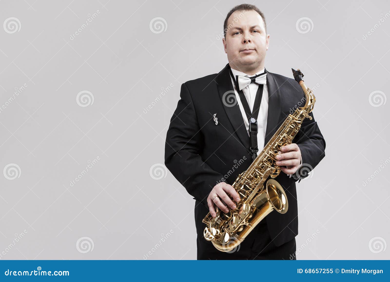 Man with Saxophone in Suite Posing Against White Background Stock Image ...