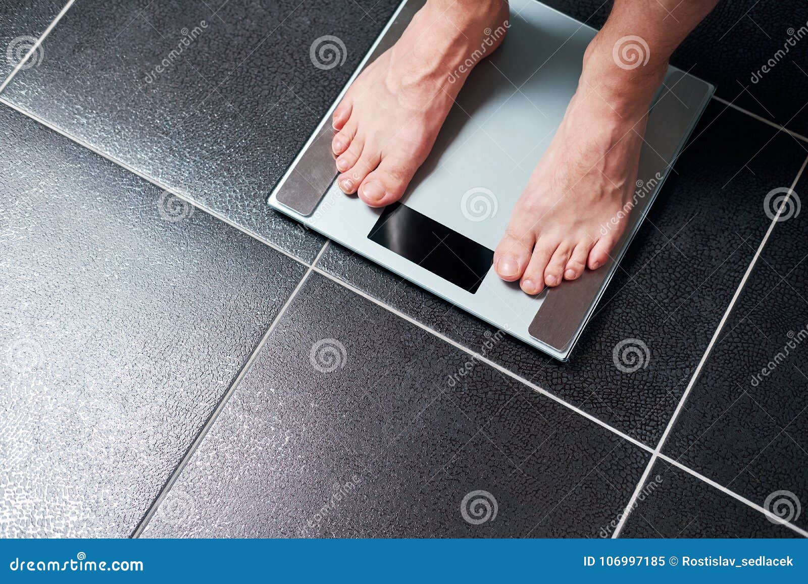 Man on the Scale in the Bathroom. Stock Image - Image of measurement ...