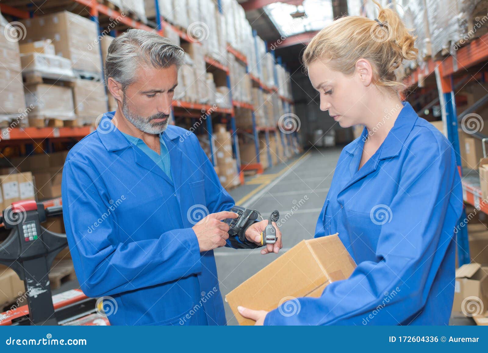 Man Scanning Box with Computerized Scanner Stock Photo - Image of ...