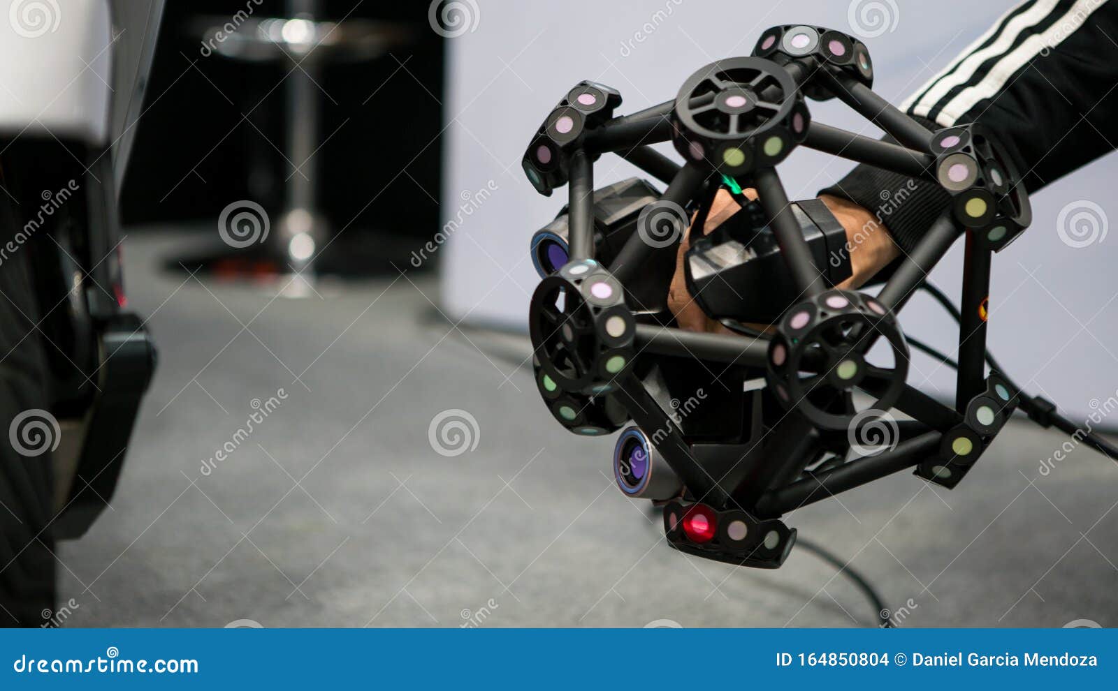Man Scanning a Motorcycle Using a Measuring Machine 3D Scan High ...