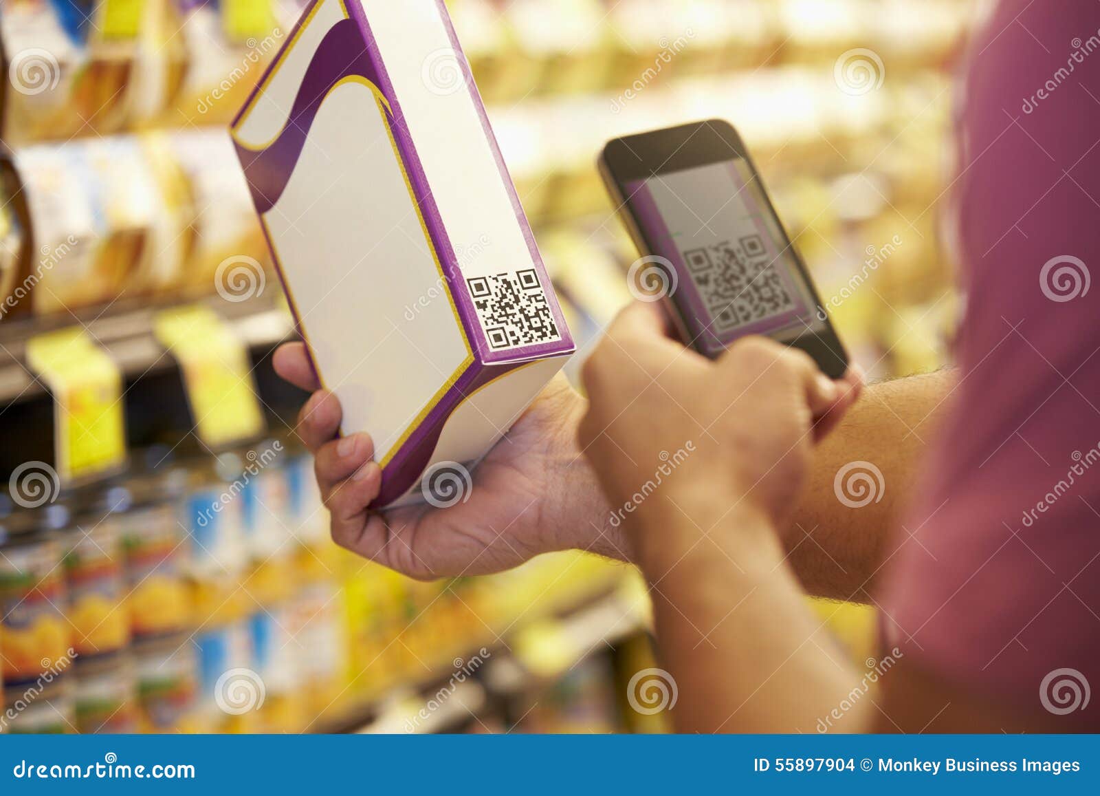Man Scanning Voucher Code In Supermarket With Mobile Phone Stock Photo ...