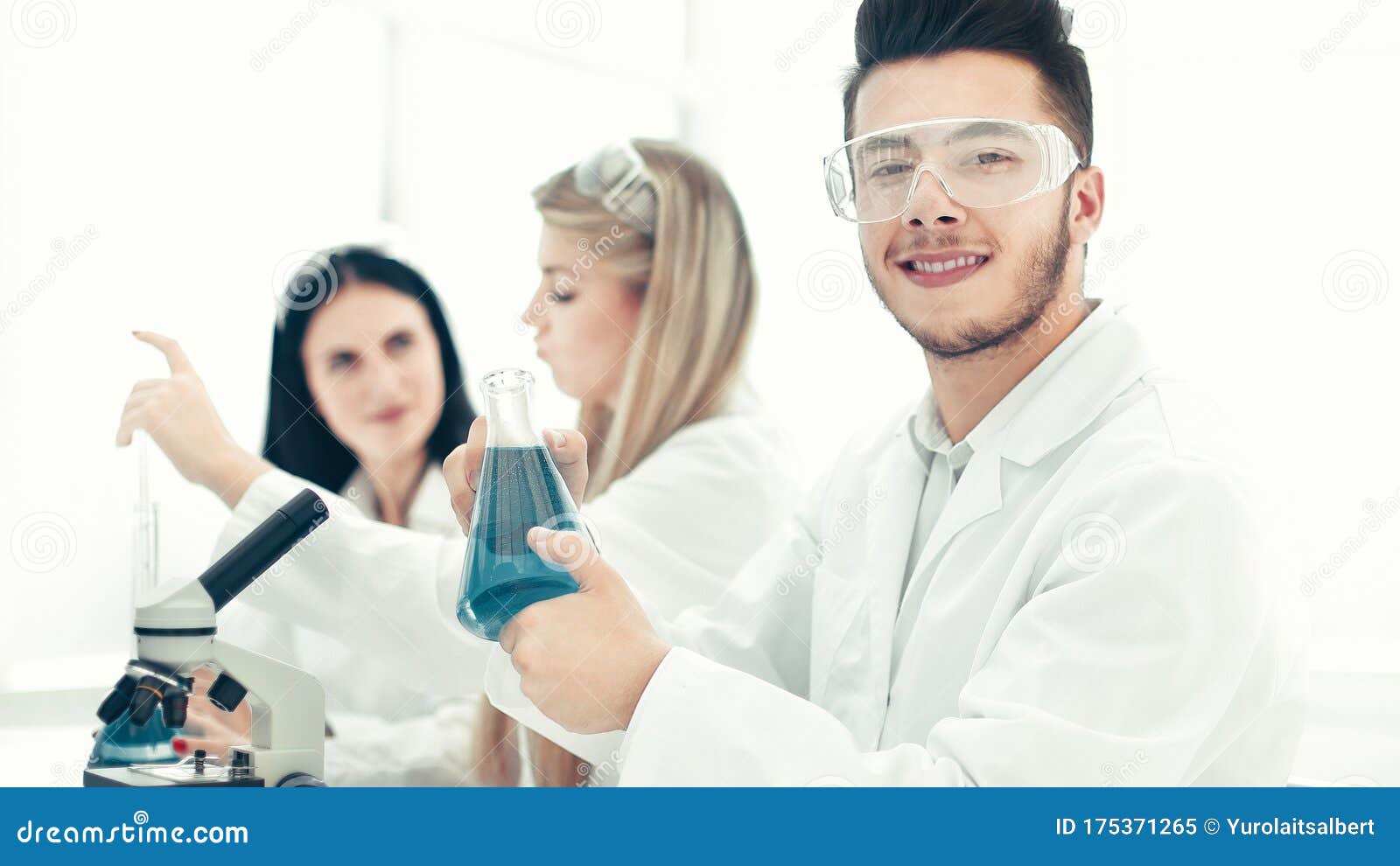 Man Scientist Holding a Flask of Liquid for the Experiment Stock Image ...
