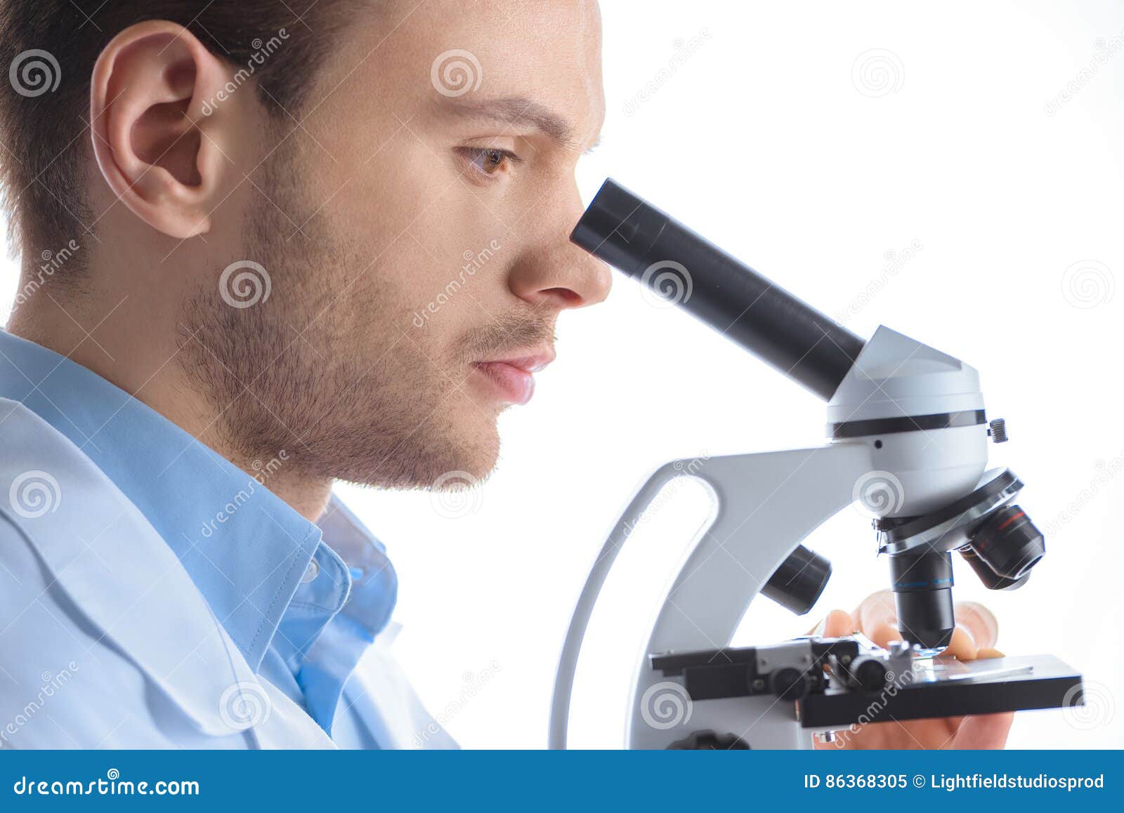 Man Scientist Looking through Microscope on White Stock Image - Image ...